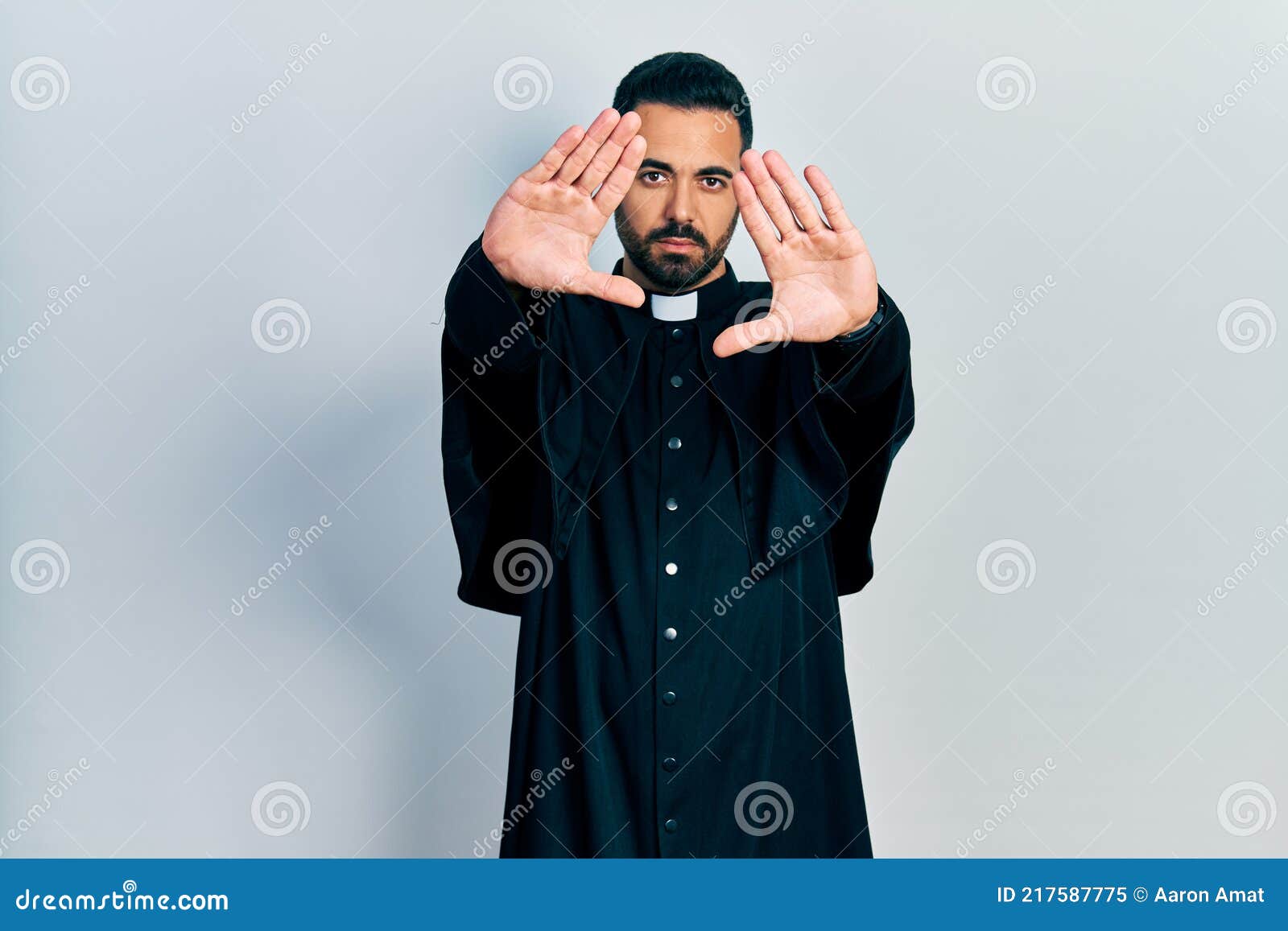 Handsome Hispanic Man with Beard Wearing Catholic Priest Robe Doing ...