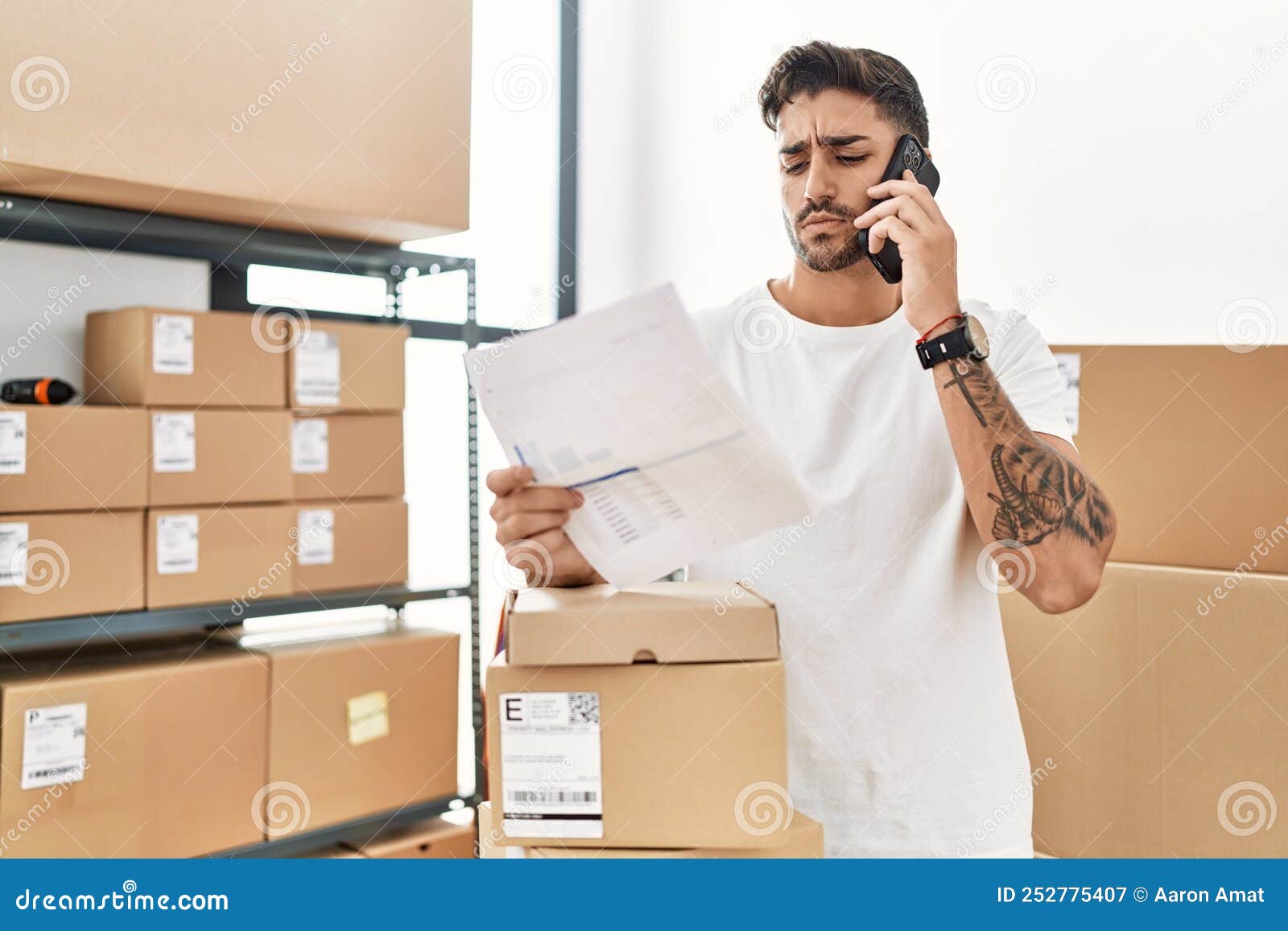 Handsome Hispanic Man Speaking on the Phone Asking for Address at E ...