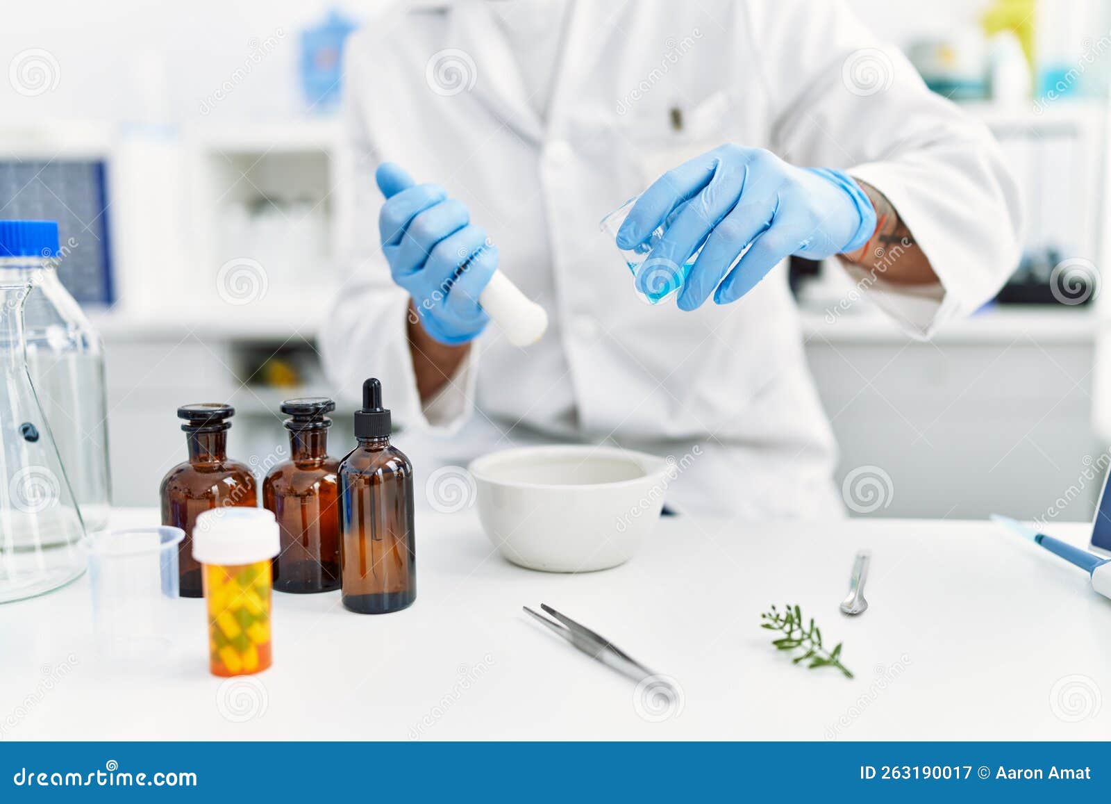 Handsome Hispanic Man Using Scientific Mortar at Laboratory Stock Image ...