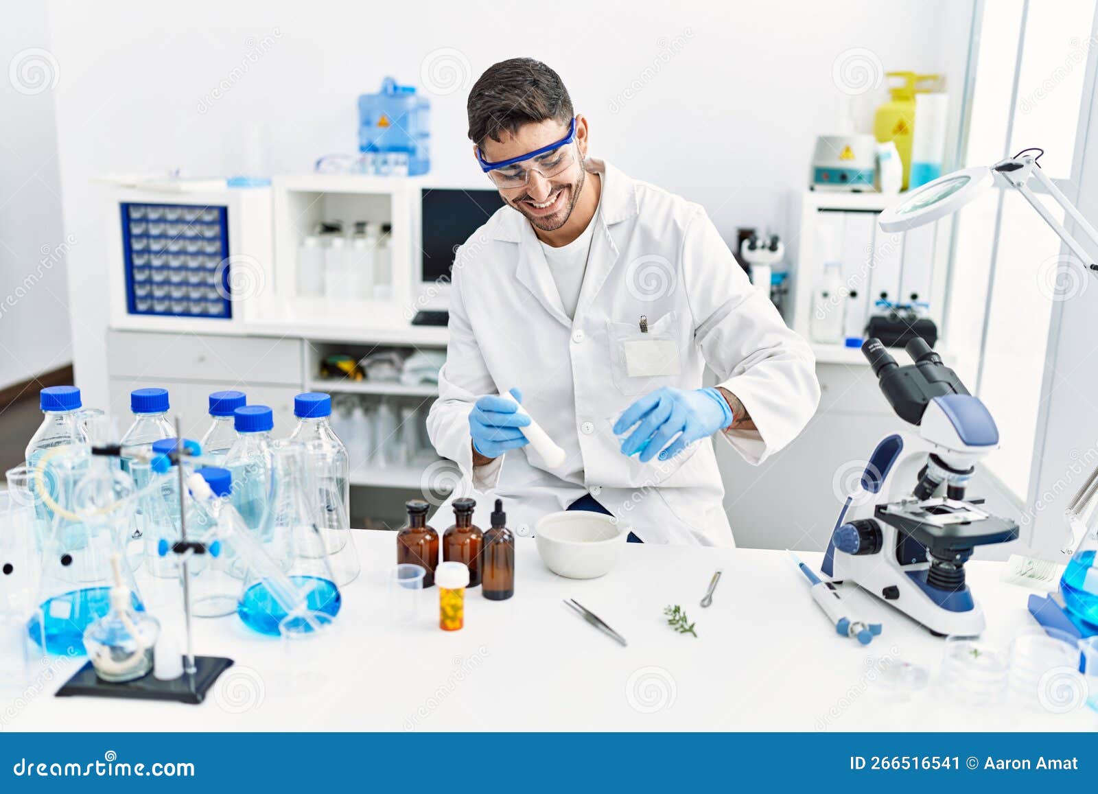 Handsome Hispanic Man Using Scientific Mortar at Laboratory Stock Image ...