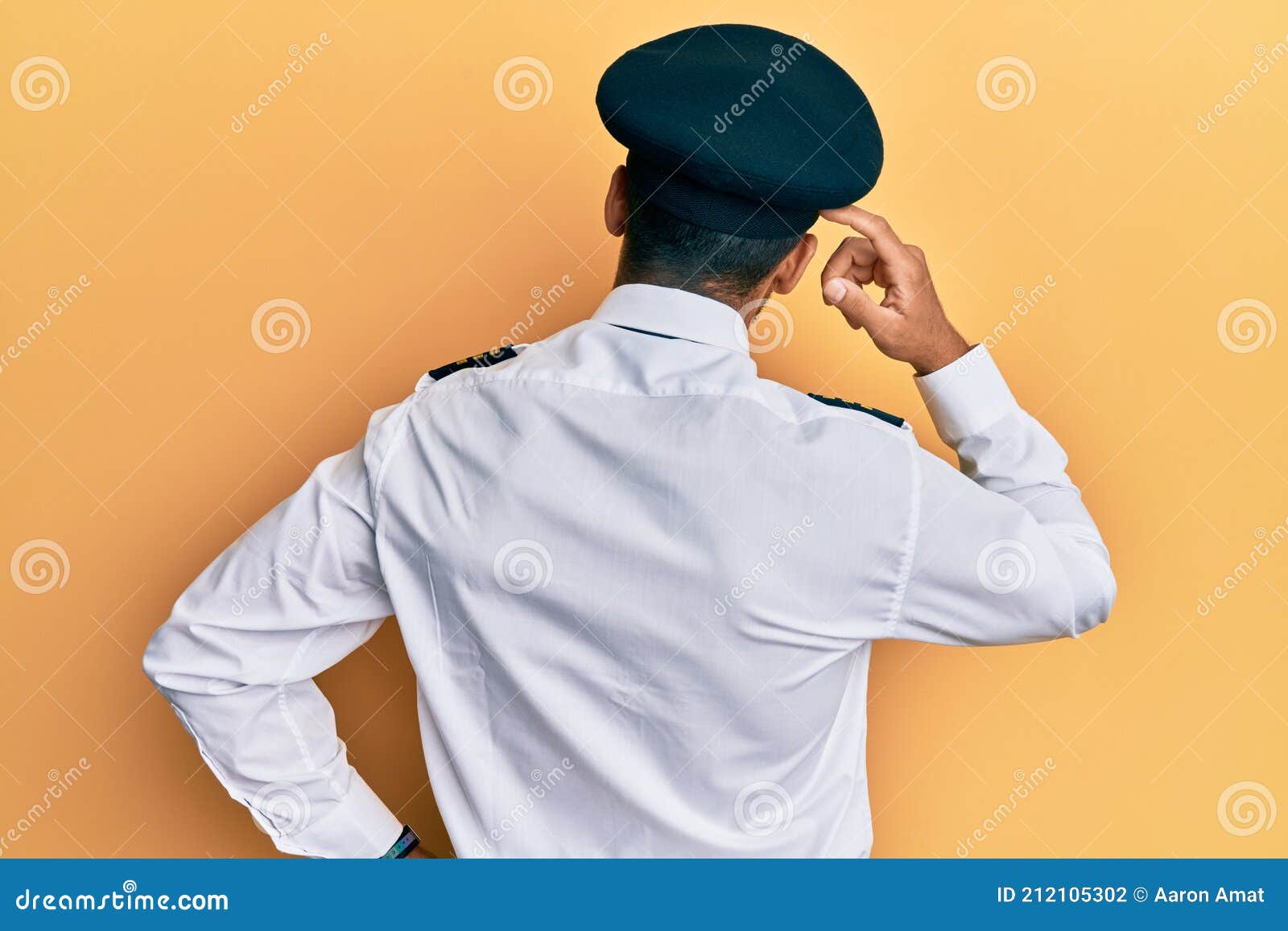 Handsome Hispanic Man Wearing Airplane Pilot Uniform Backwards Thinking ...