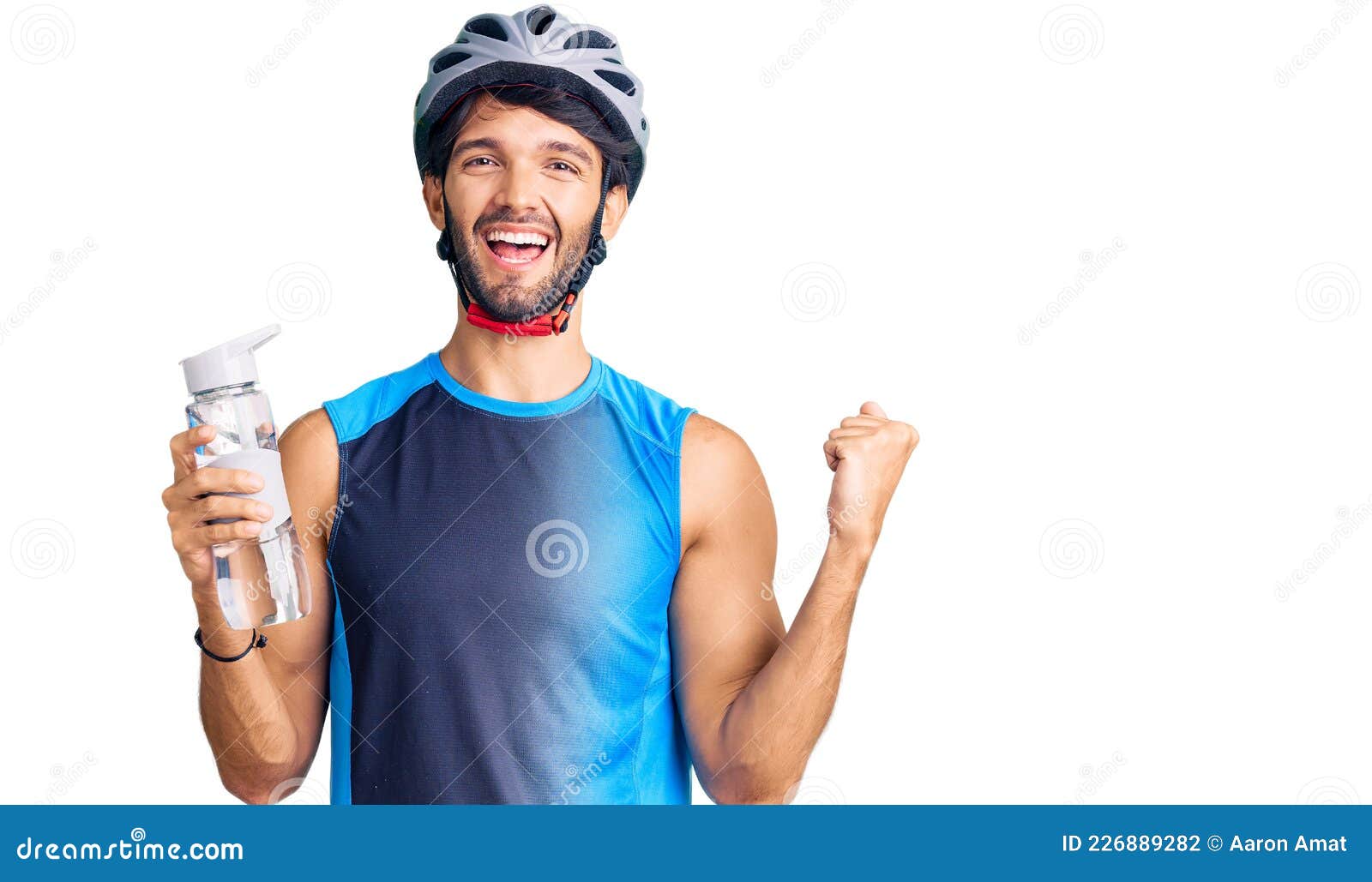 Handsome Hispanic Man Wearing Bike Helmet And Holding Water Bottle