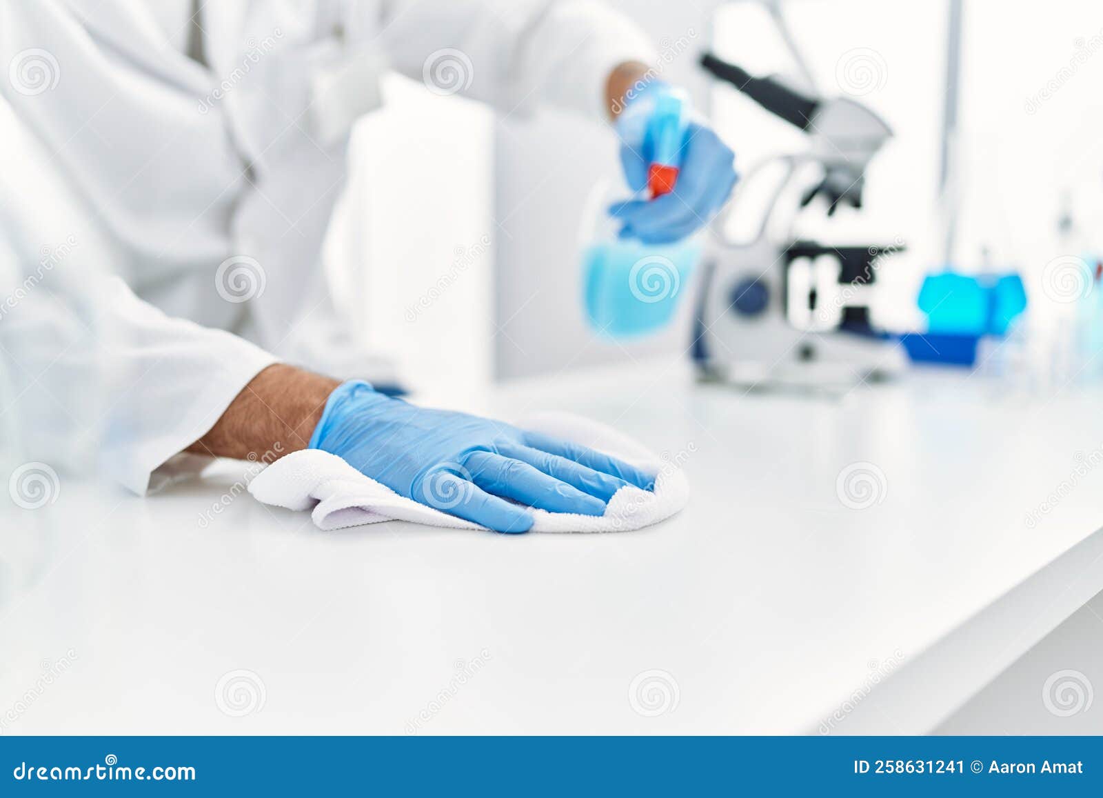 Handsome Hispanic Man Working As Scientific Cleaning the Table at ...