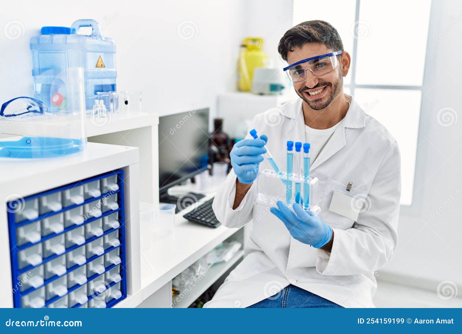 Handsome Hispanic Man Working As Scientific Holding Test Tubes at ...