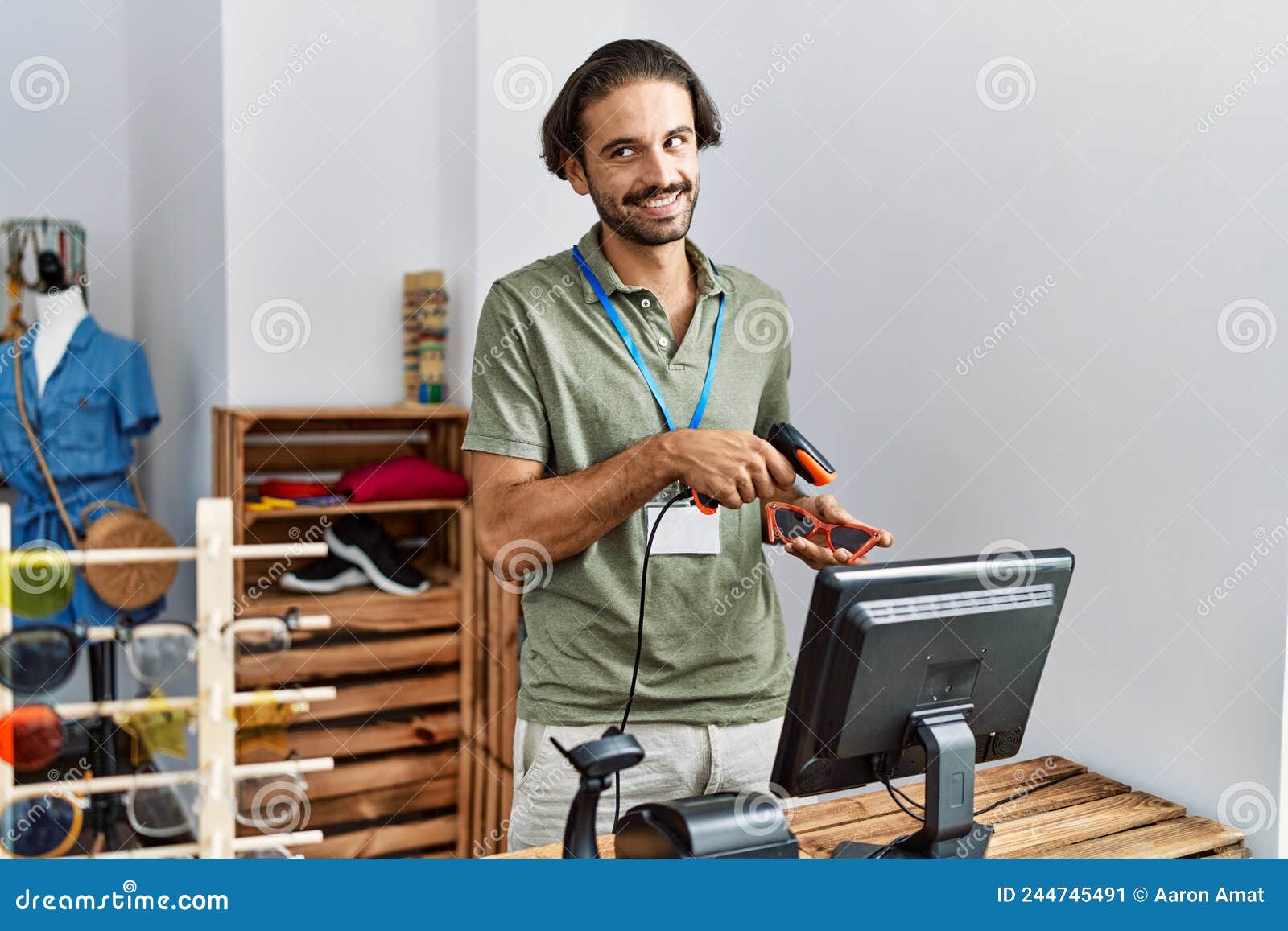 Handsome Hispanic Man Working at Shop Using Barcode Scanner at Retail ...