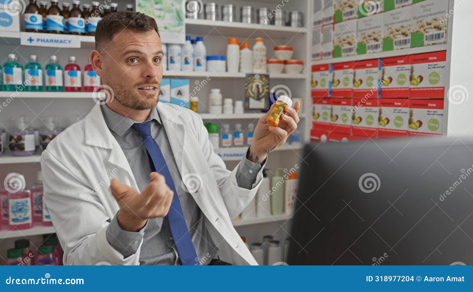 Handsome Hispanic Pharmacist in a White Coat Discusses Medication with ...