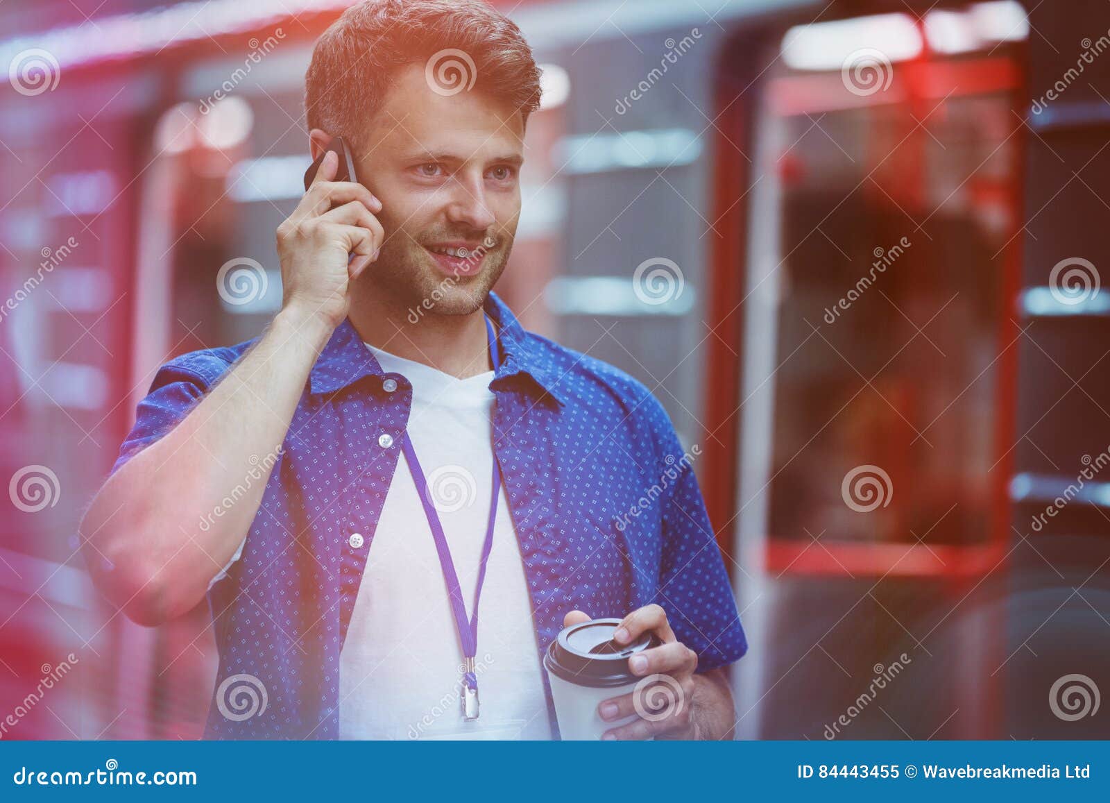 Handsome Holding Disposable Cup while Talking on Mobile Phone Stock ...