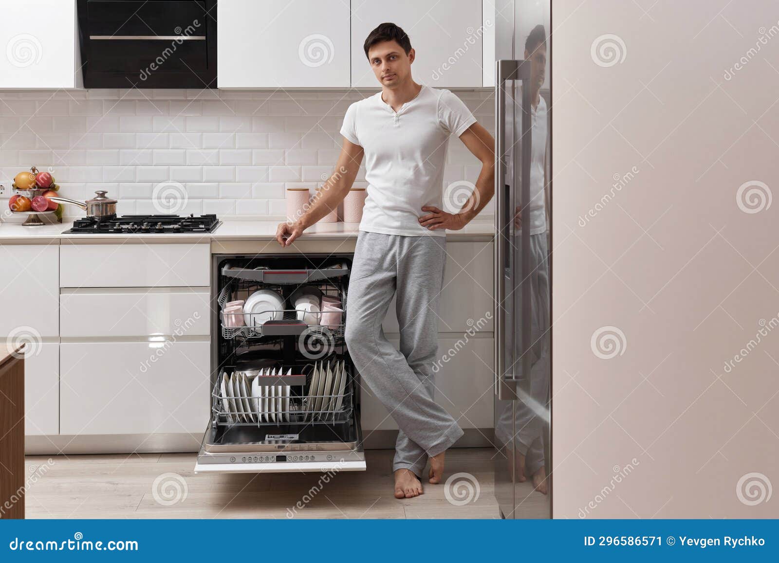 Handsome Husband Man Using Dishwasher in White Modern Kitchen Stock ...