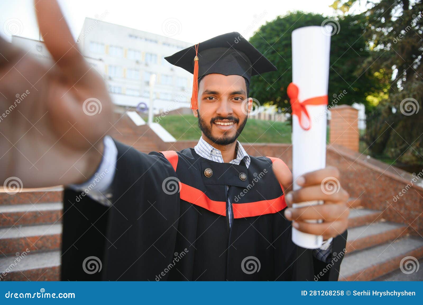 Handsome Indian Graduate in Graduation Glow with Diploma. Stock Photo ...