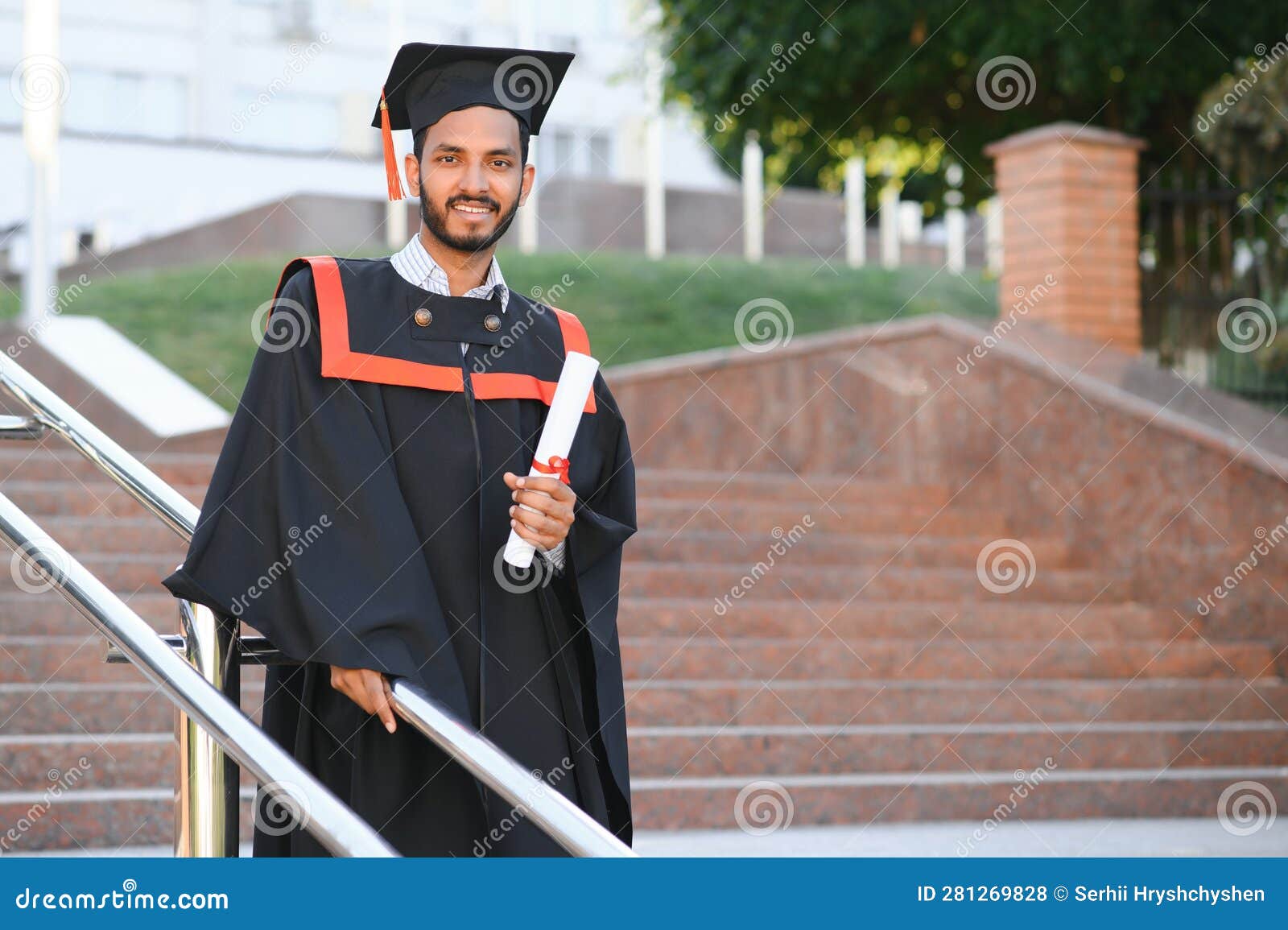 Handsome Indian Graduate in Graduation Glow with Diploma. Stock Photo ...