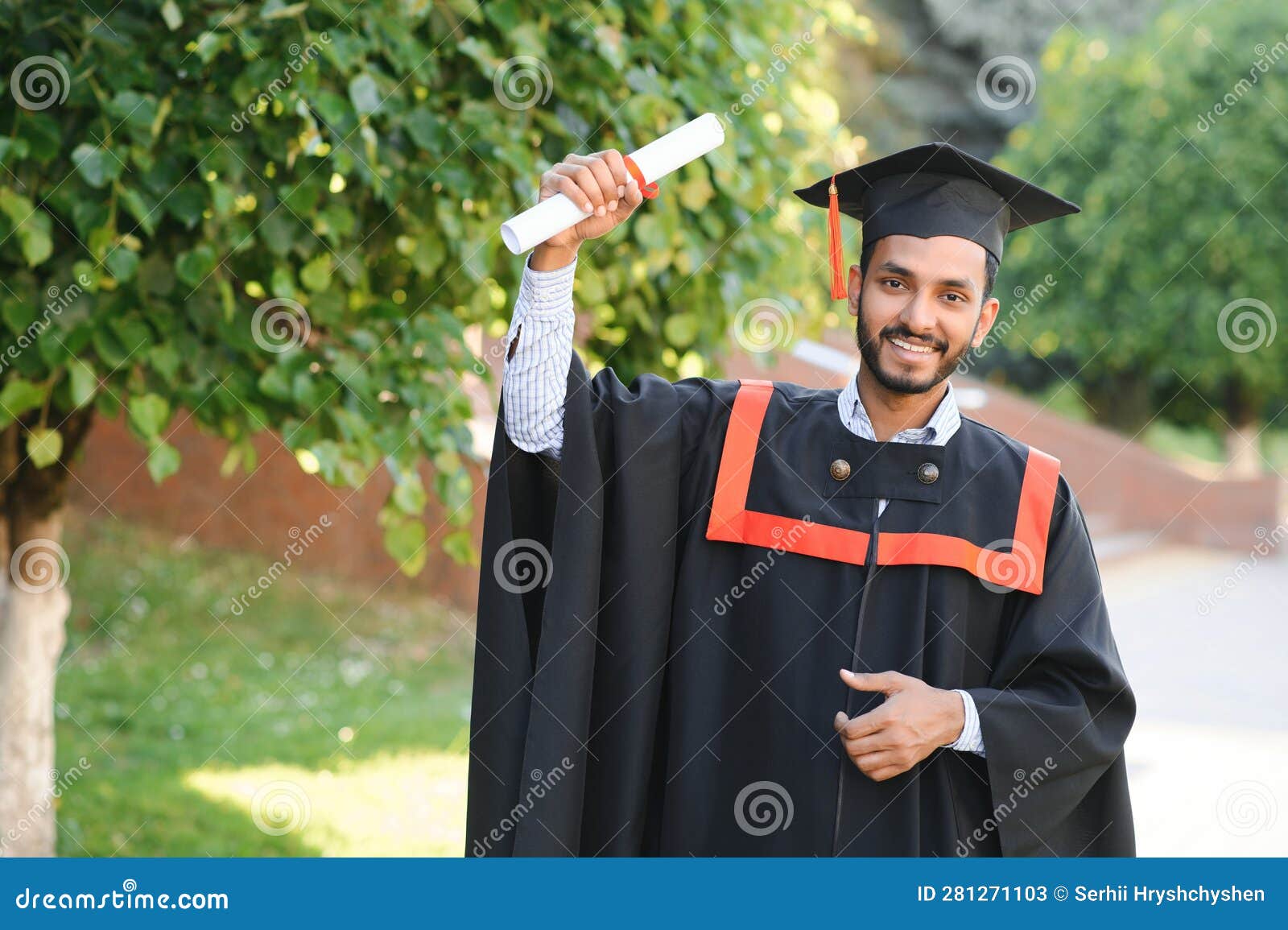 Handsome Indian Graduate in Graduation Glow with Diploma. Stock Image ...
