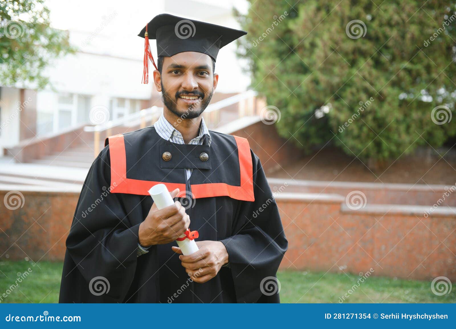 Handsome Indian Graduate in Graduation Glow with Diploma. Stock Photo ...