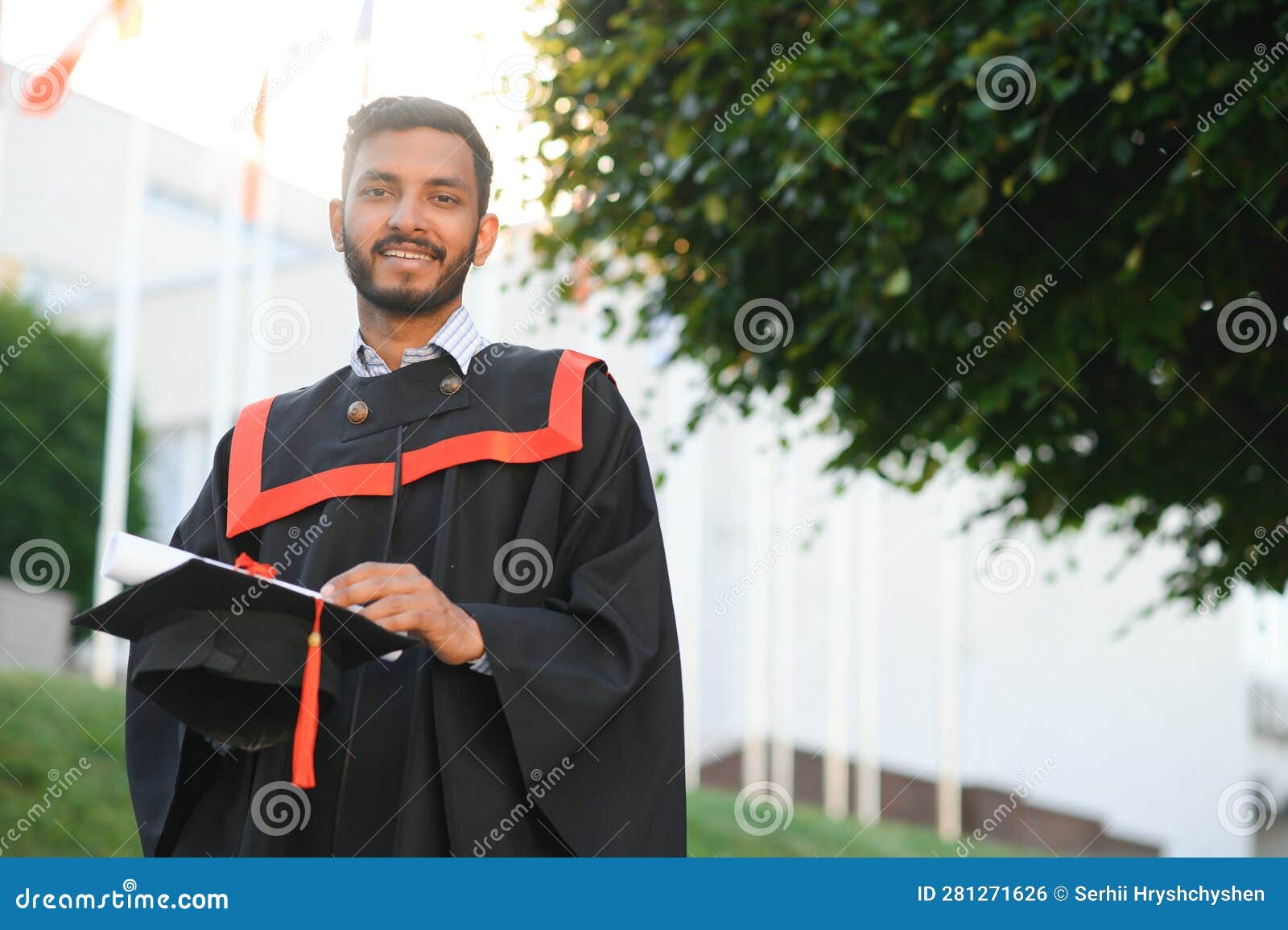Handsome Indian Graduate in Graduation Glow with Diploma. Stock Photo ...