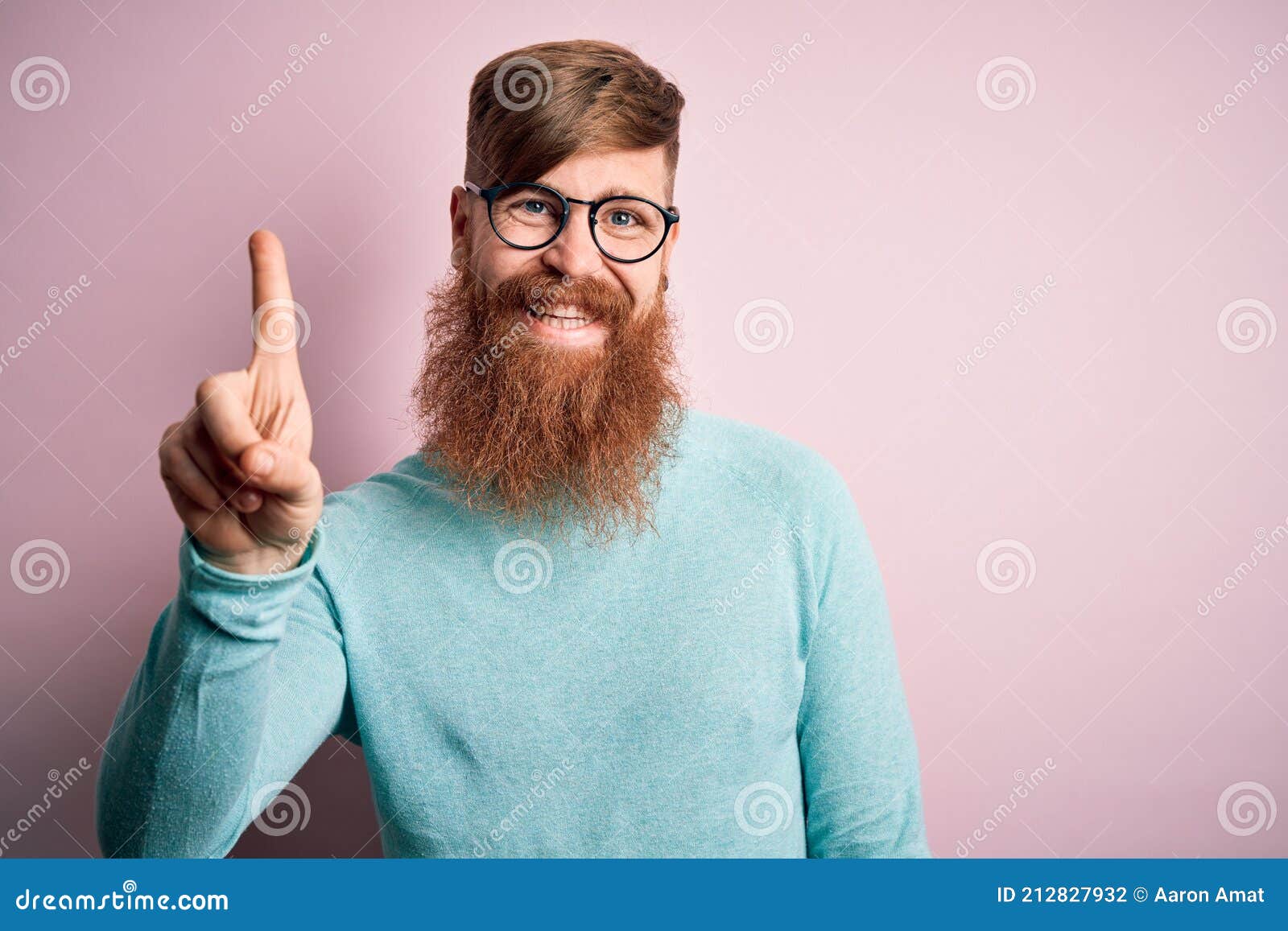 Handsome Irish Redhead Man With Beard Wearing Glasses Over Pink