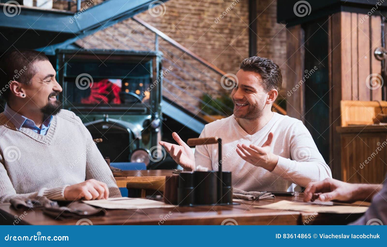 Handsome Joyful Man Explaining Something To a Friend Stock Image ...