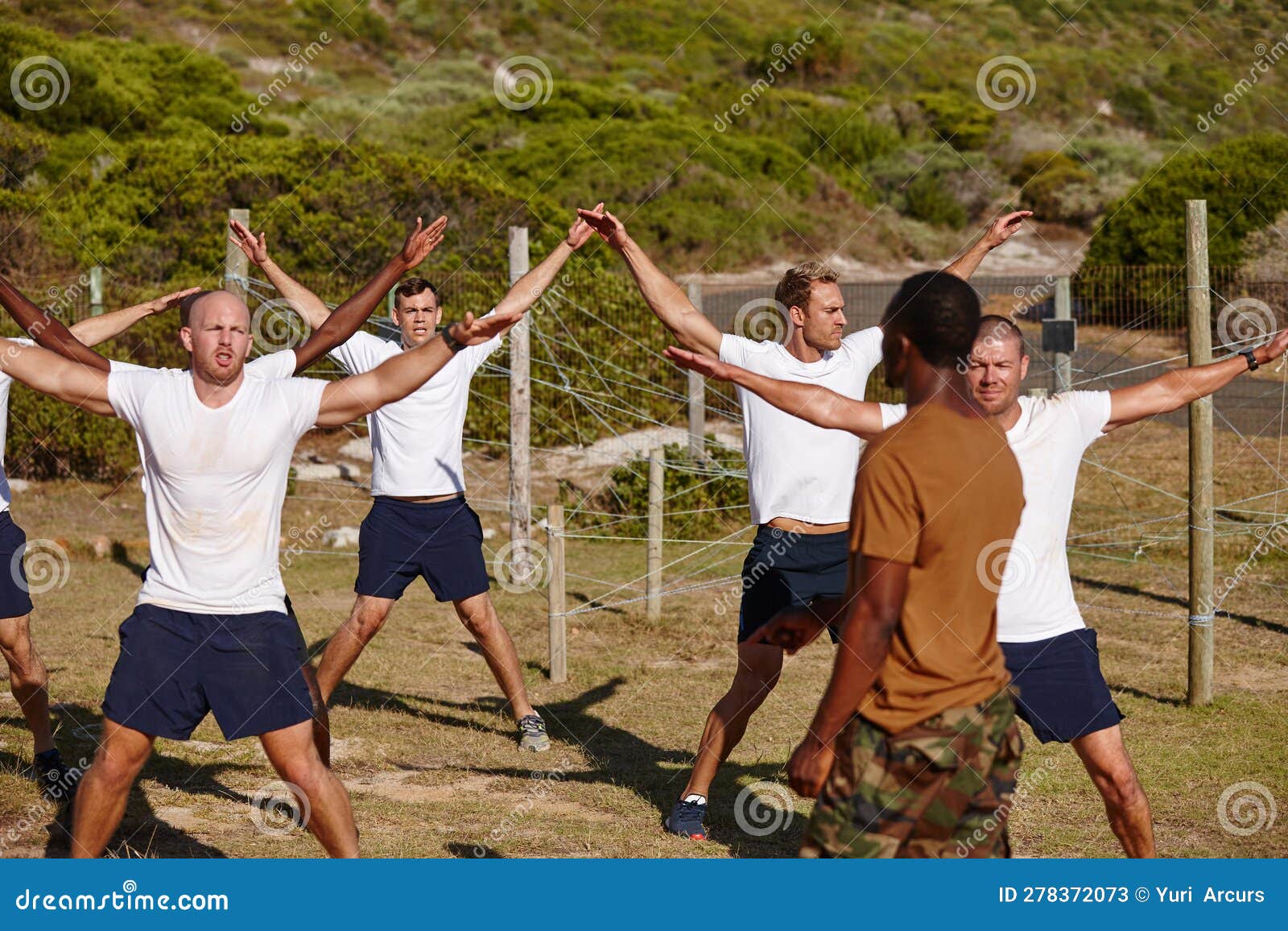 Handsome Jumping Jacks. a Group of Men Doing Star Jumps at a Military ...
