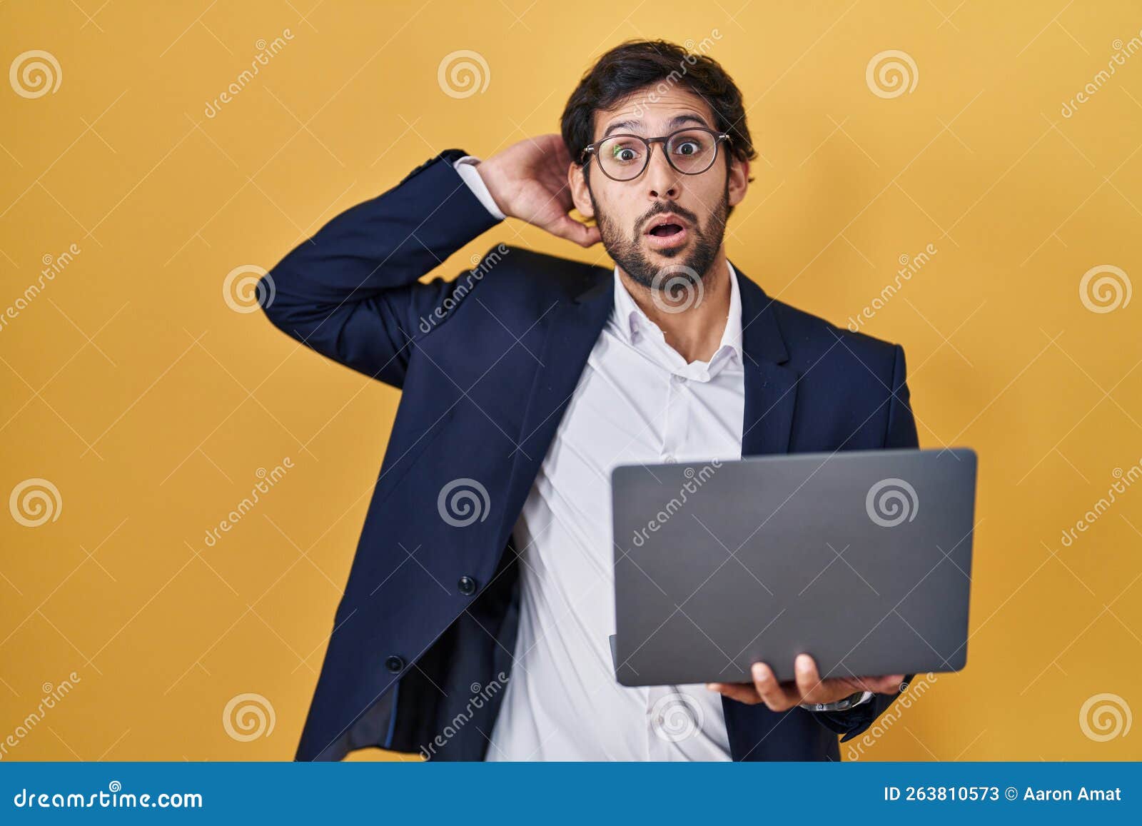 Handsome Latin Man Working Using Computer Laptop Crazy and Scared with ...