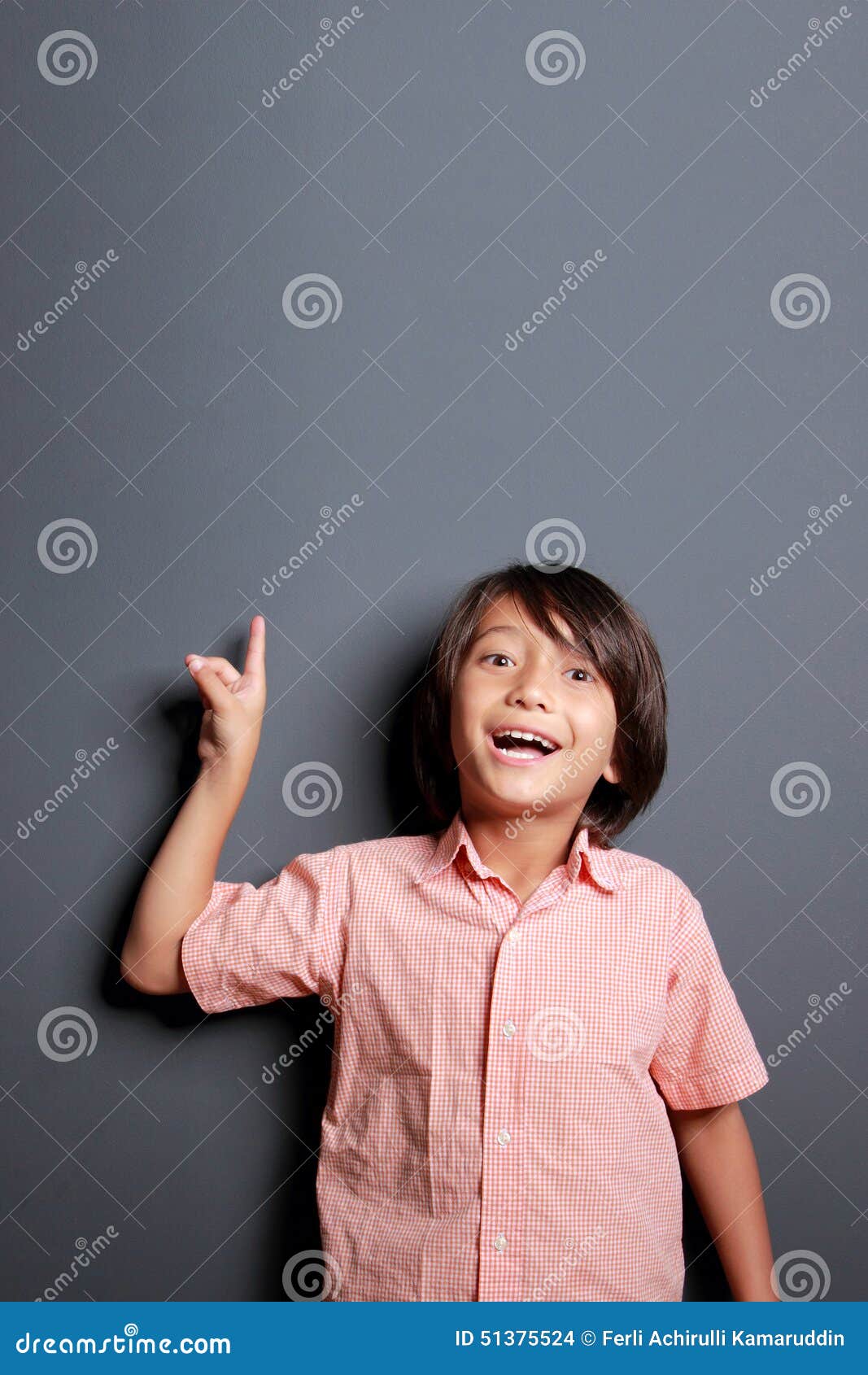 Handsome Little Boy Pointing Upwards Stock Photo - Image of brown ...