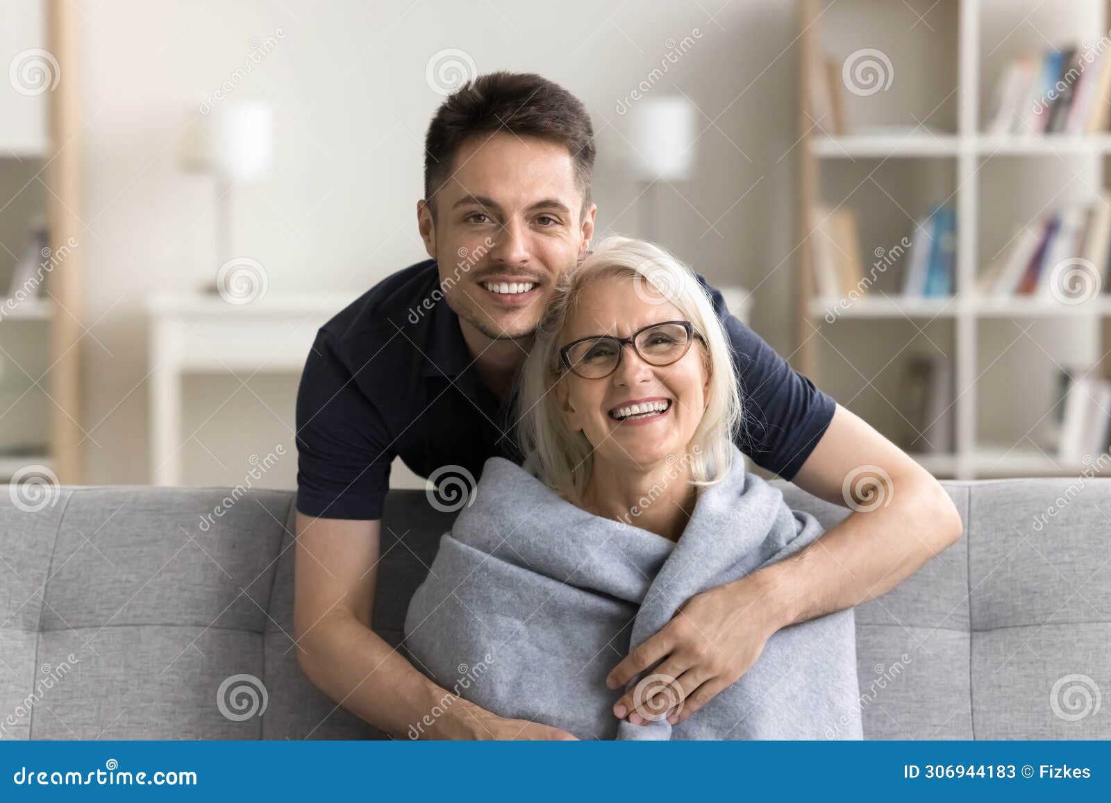 Handsome Loving Adult Son Man Hugging Mature Mom From Behind Stock