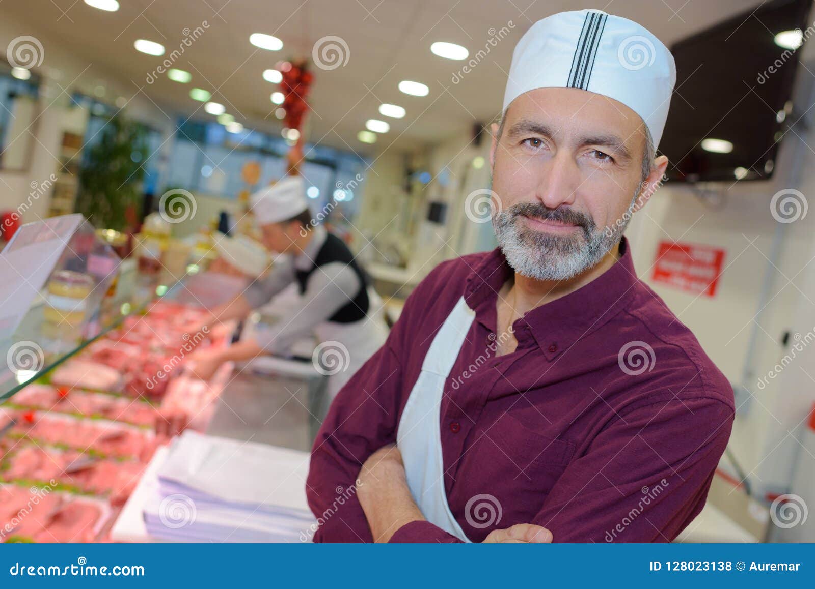 Handsome Male Butcher Working with Meat in Store Stock Photo - Image of ...