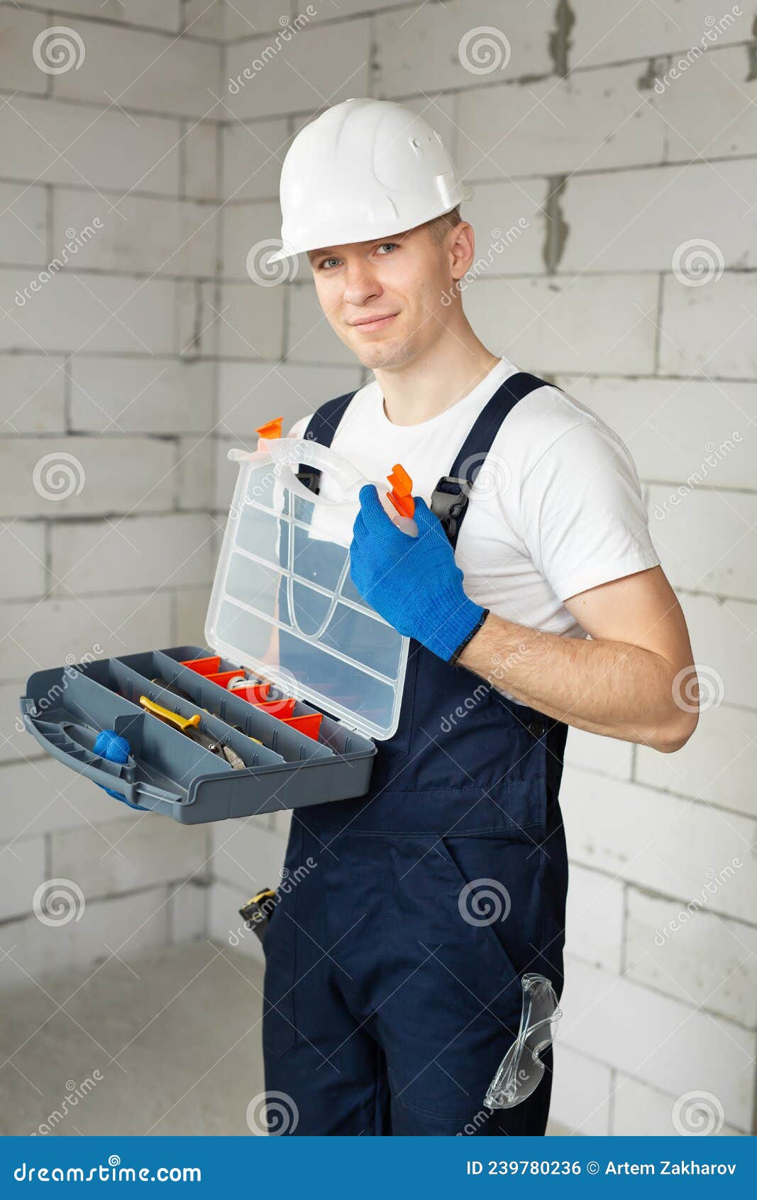 Handsome Male Construction Worker with a Tool Box Isolated Against a ...