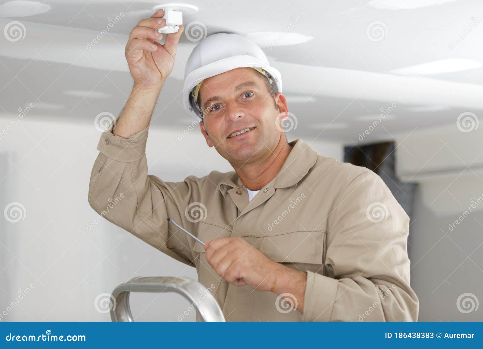 Handsome Male Electrician Changing Light Bulb Stock Image - Image of ...