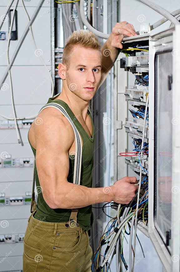 Handsome Male Electrician in Front of Power Panel Stock Photo - Image ...