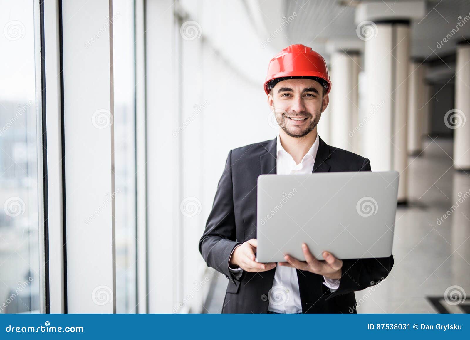 Handsome Male Engineer is Using a Notebook for Work. Stock Image ...