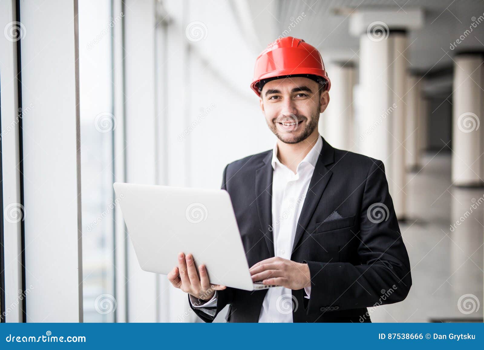 Handsome Male Engineer is Using a Notebook for Work. Stock Photo ...