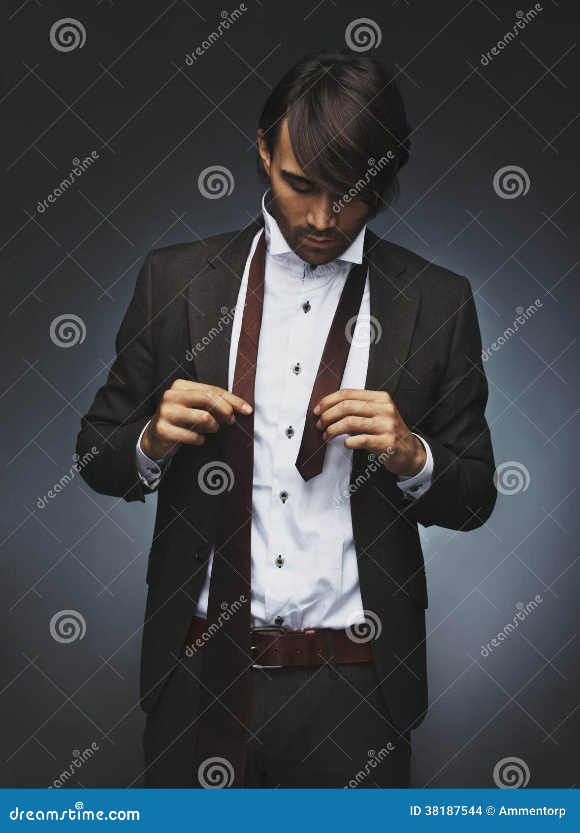 Handsome Male Fashion Model Getting Dressed Stock Photo - Image of ...
