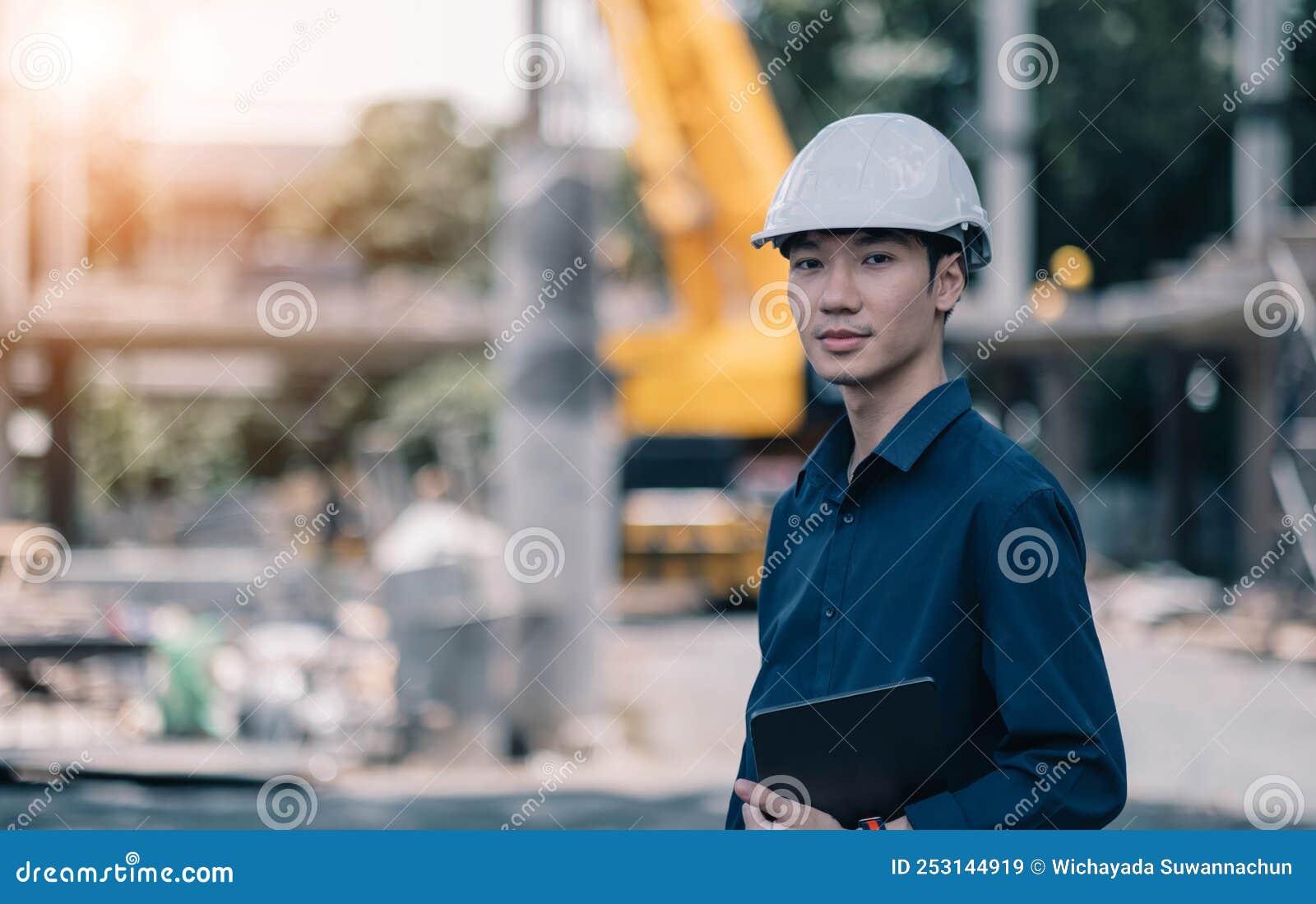 Handsome Male Foreman Engineer Wearing Helmet Controls and Maintains ...