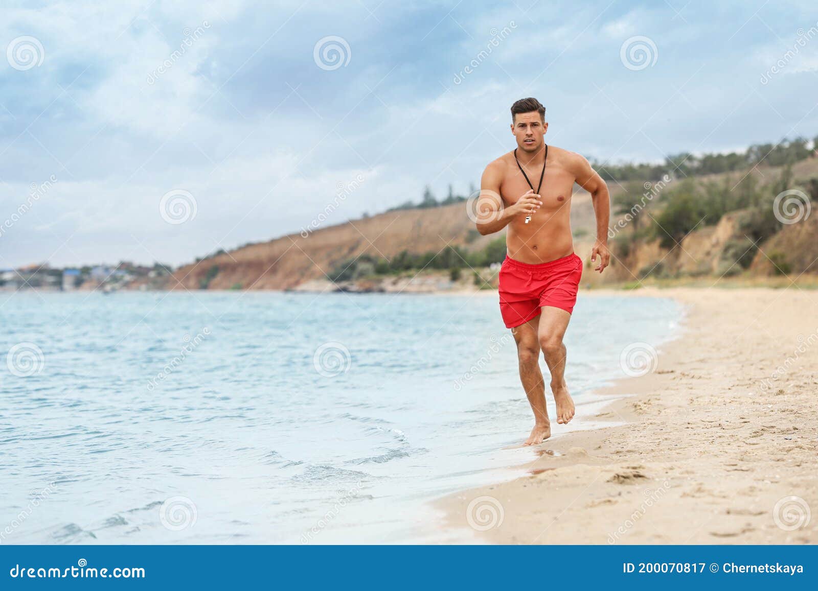 Handsome Male Lifeguard Running on Sandy Beach Stock Image - Image of ...