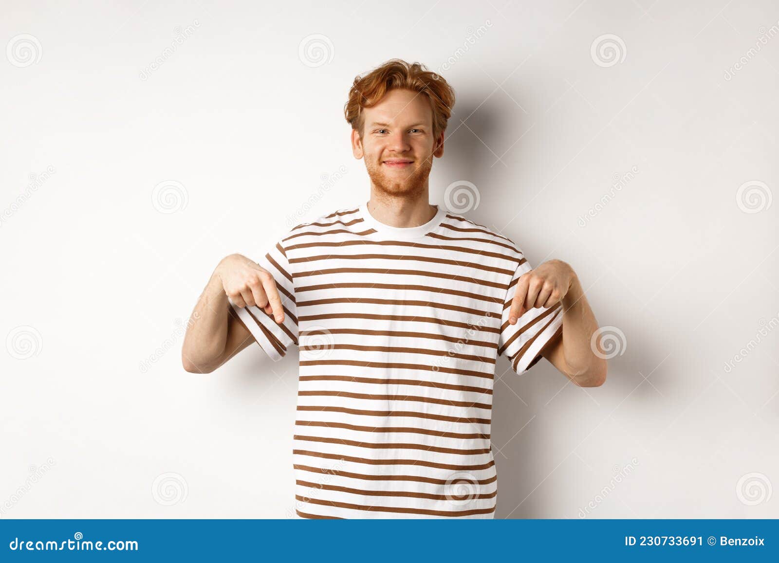 Handsome Male Model With Ginger Hair And Bristle Pointing Fingers Down