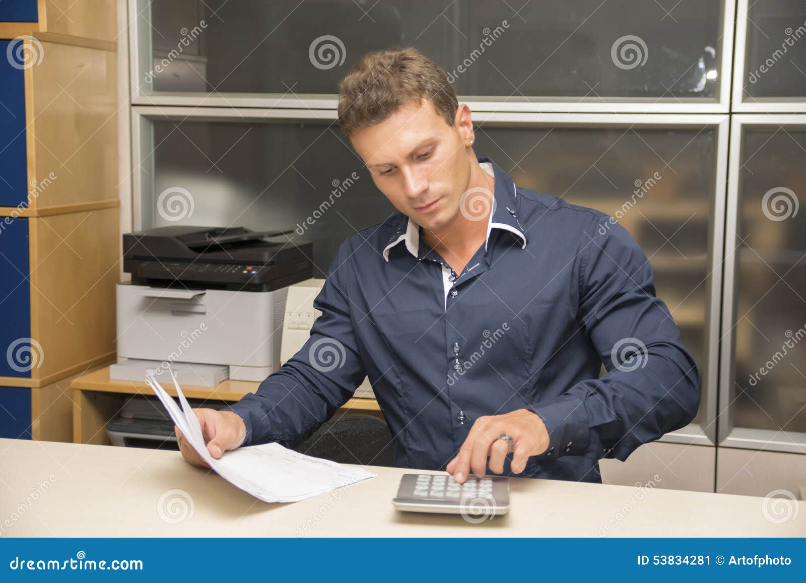 Handsome Male Office Worker Using Calculator Stock Image - Image of ...