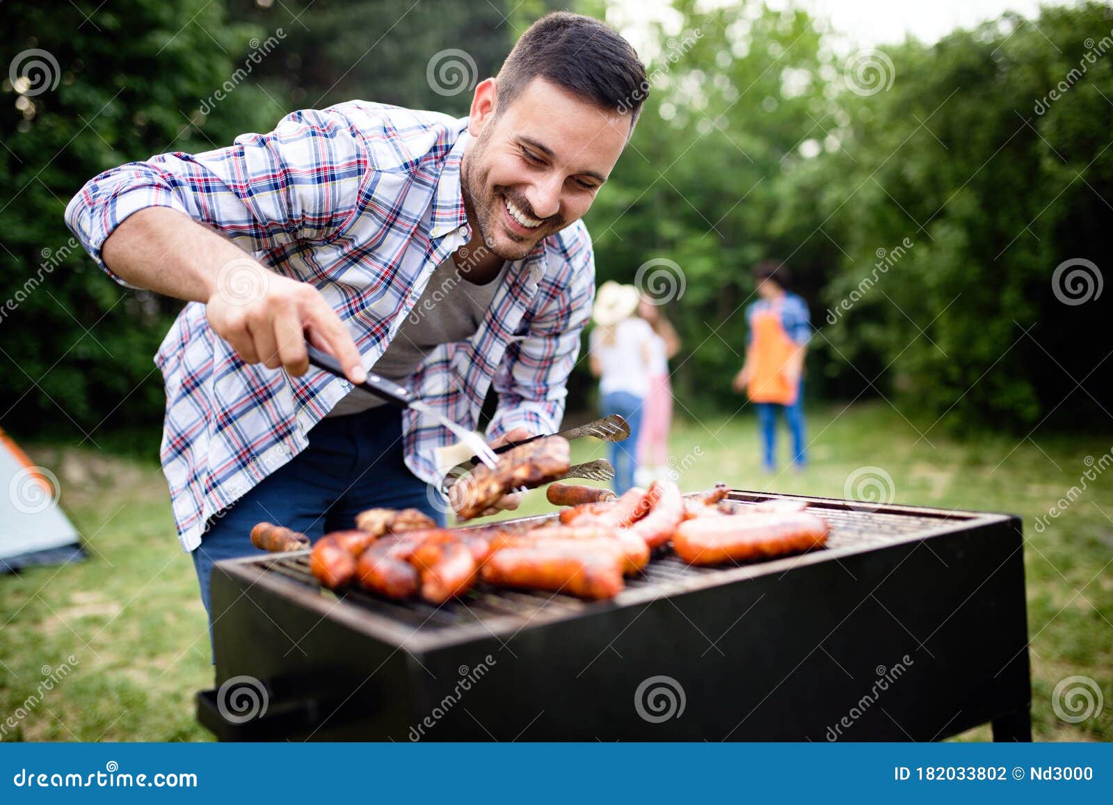Handsome Male Preparing Barbecue, Grill Outdoors for Friends Stock ...