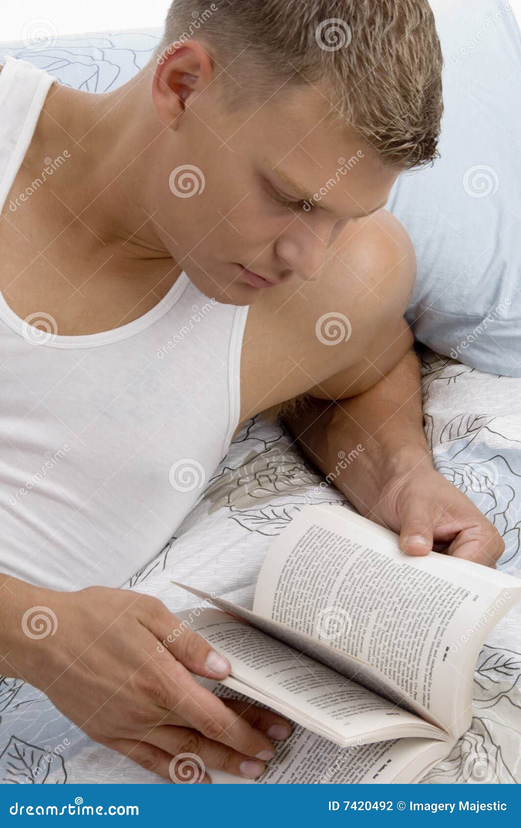 Handsome male reading book stock photo. Image of years - 7420492