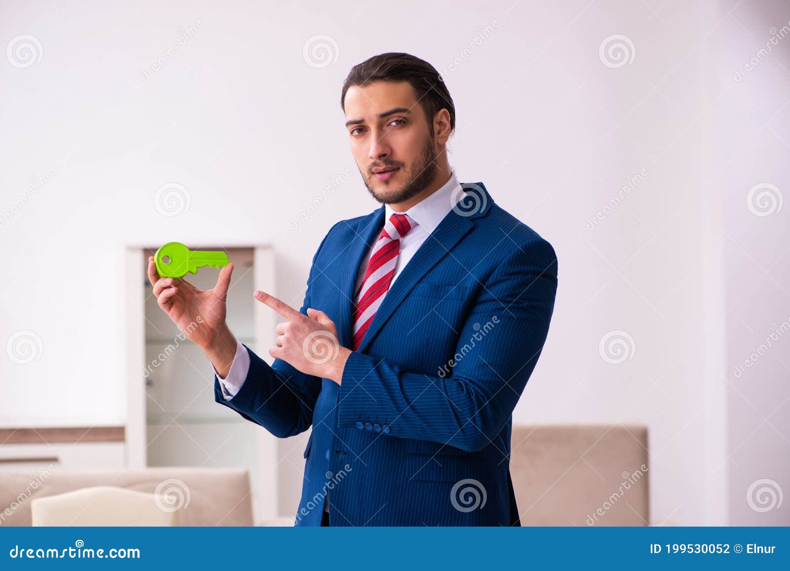 Handsome Male Realtor Working Indoors Stock Photo - Image of keys ...