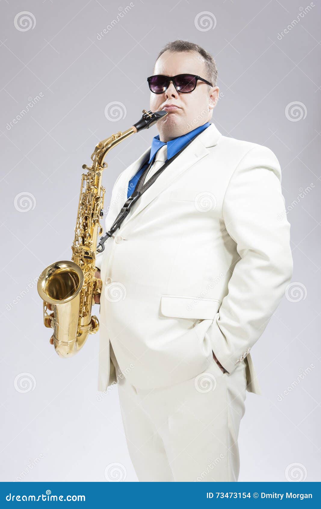 Handsome Male Saxo Player in Stylish White Suit and Sunglasses Posing ...