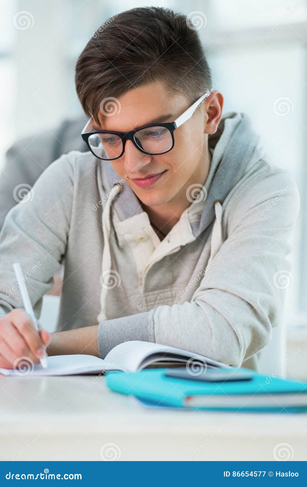 Handsome Male Student Making Notes Stock Image - Image of confident ...