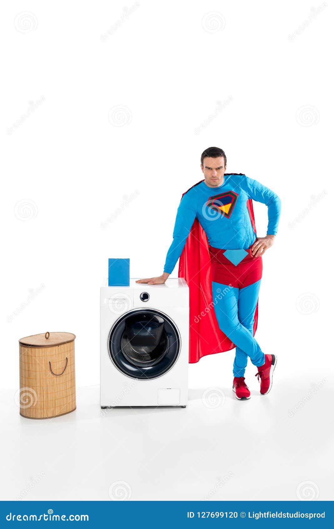 Handsome Male Superhero Leaning at Washing Machine and Looking at ...