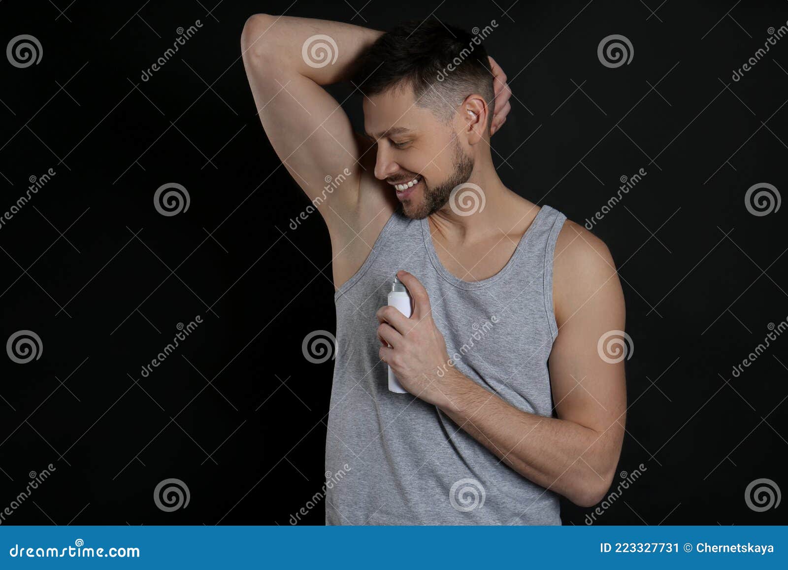 Handsome Man Applying Deodorant on Black Background Stock Image - Image ...