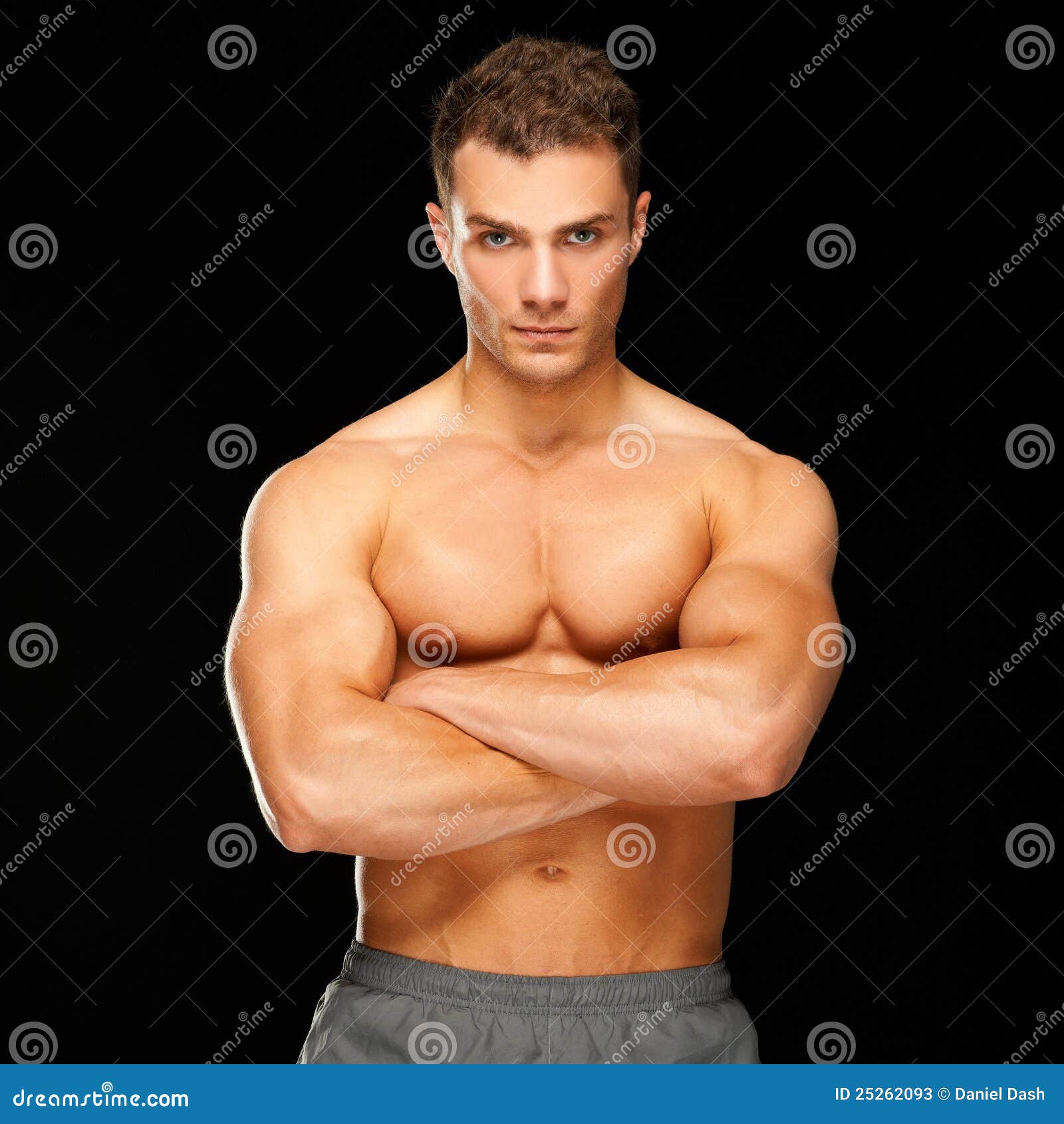 Handsome Man With Arms Crossed Looking His Left On Black Stock Image