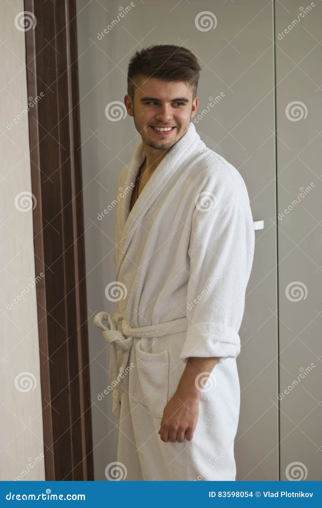 Handsome man in bathrobe stock photo. Image of wellness - 83598054