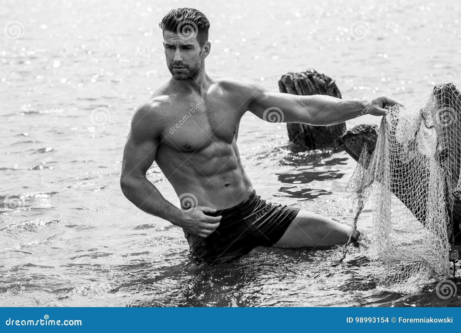 Handsome man on the beach. stock photo. Image of face - 98993154
