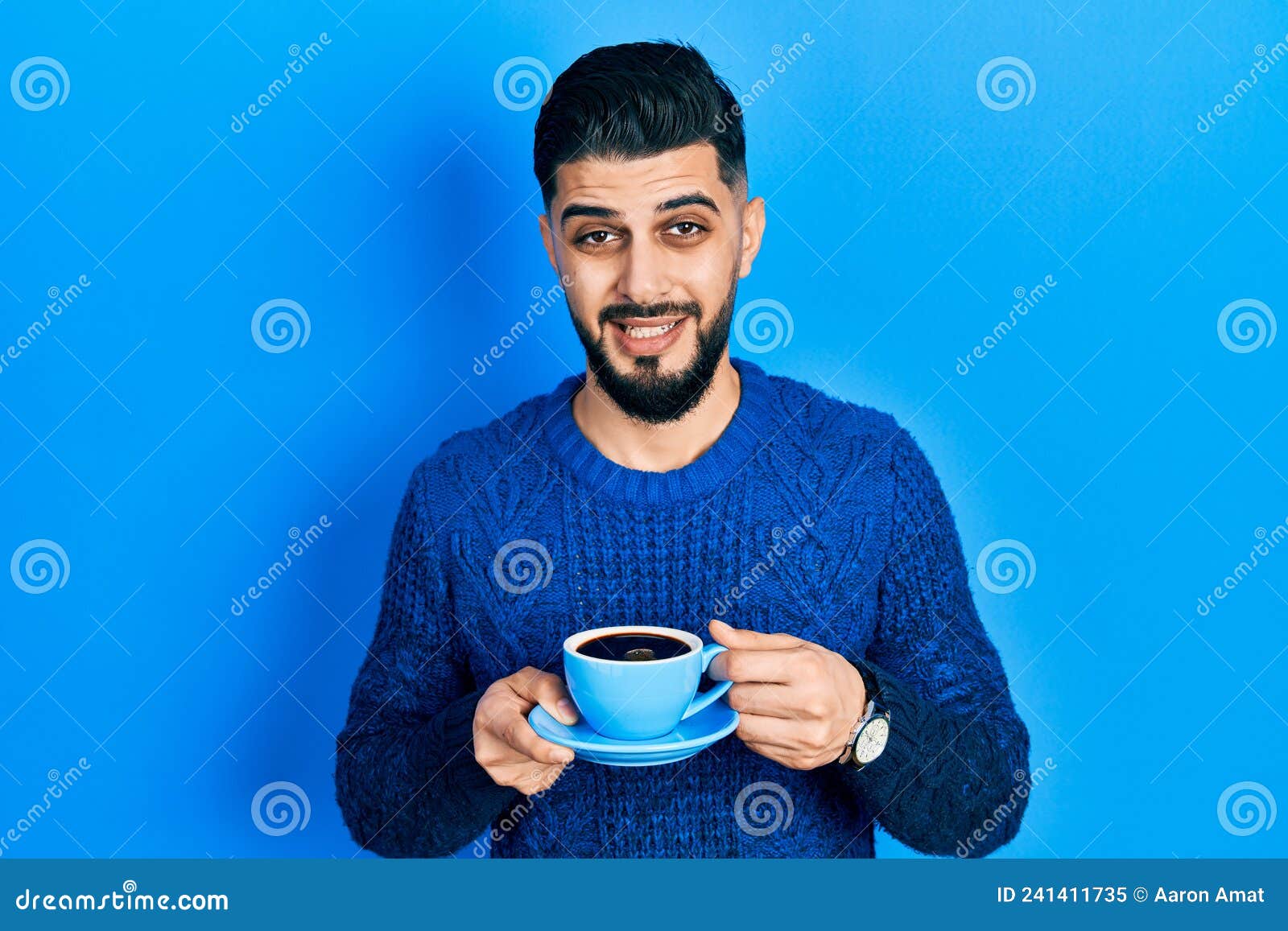 Handsome Man with Beard Drinking a Cup of Coffee Clueless and Confused ...