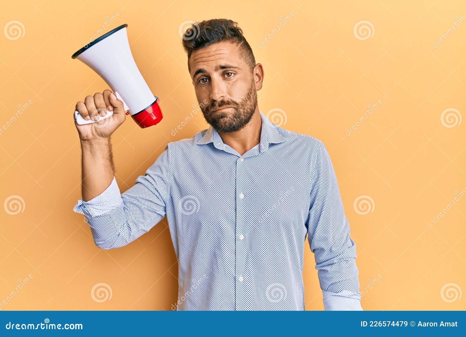 Handsome Man with Beard Shouting through Megaphone Depressed and Worry ...