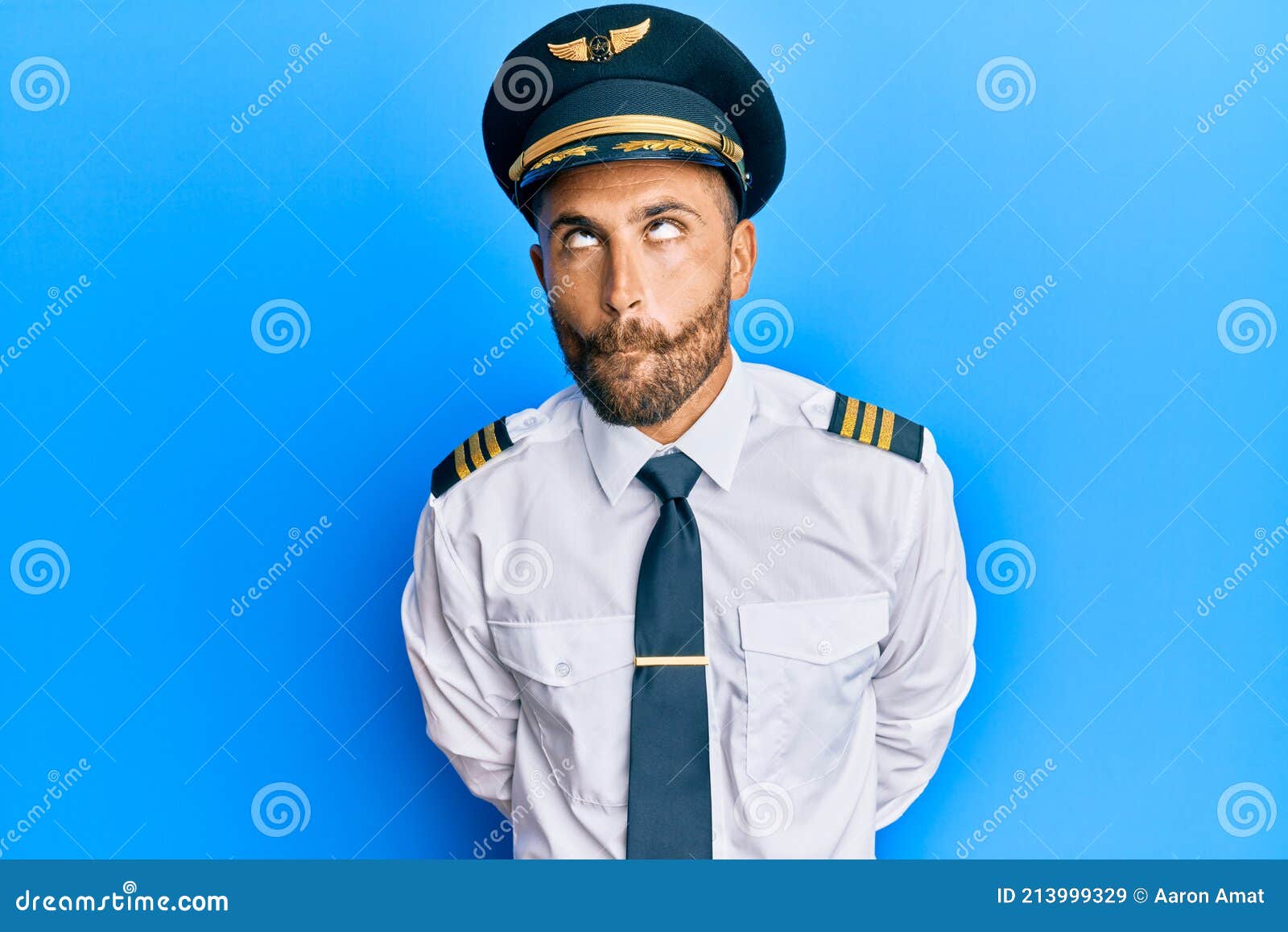 Handsome Man with Beard Wearing Airplane Pilot Uniform Making Fish Face ...