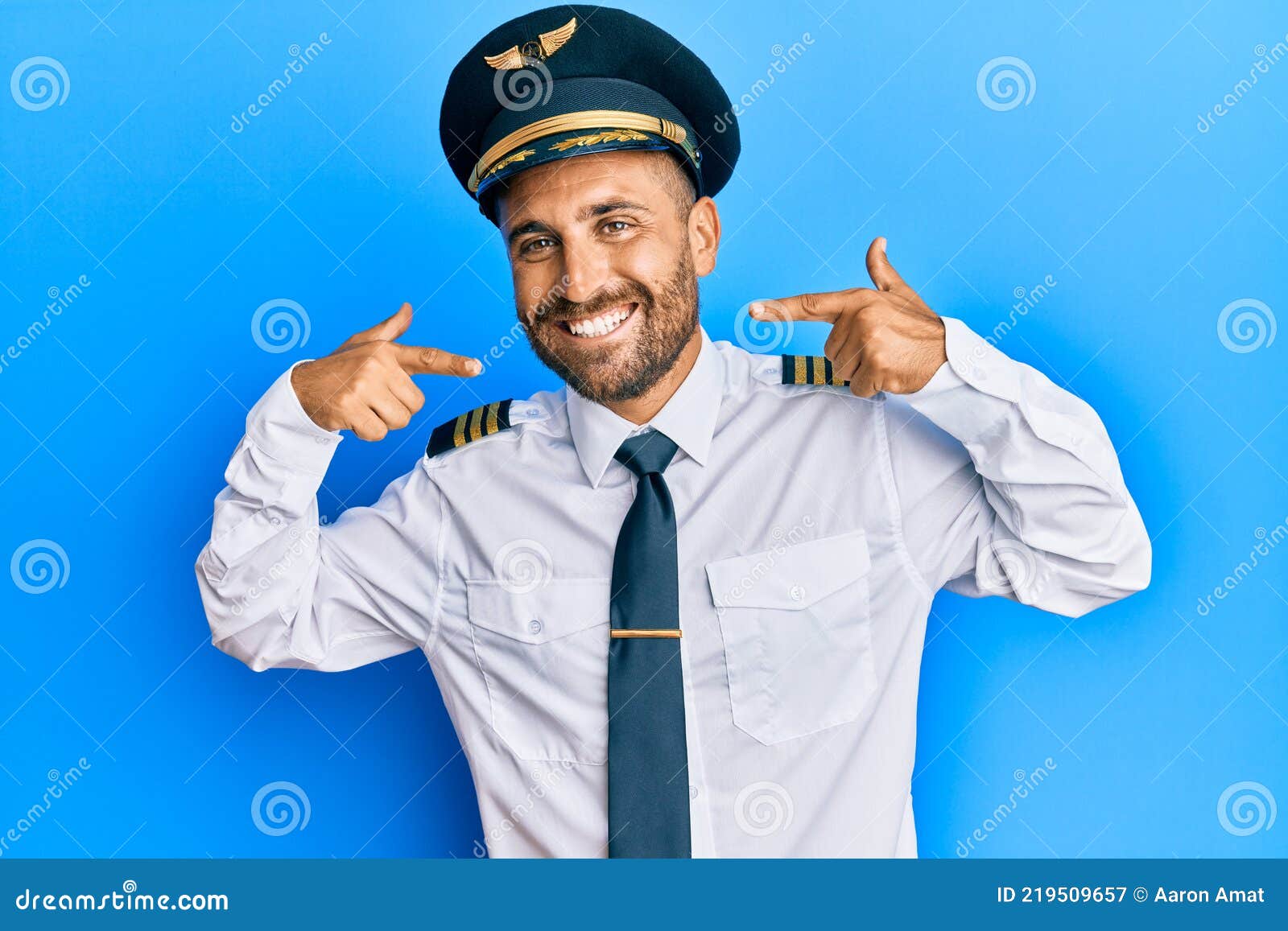 Handsome Man With Beard Wearing Airplane Pilot Uniform Smiling Cheerful