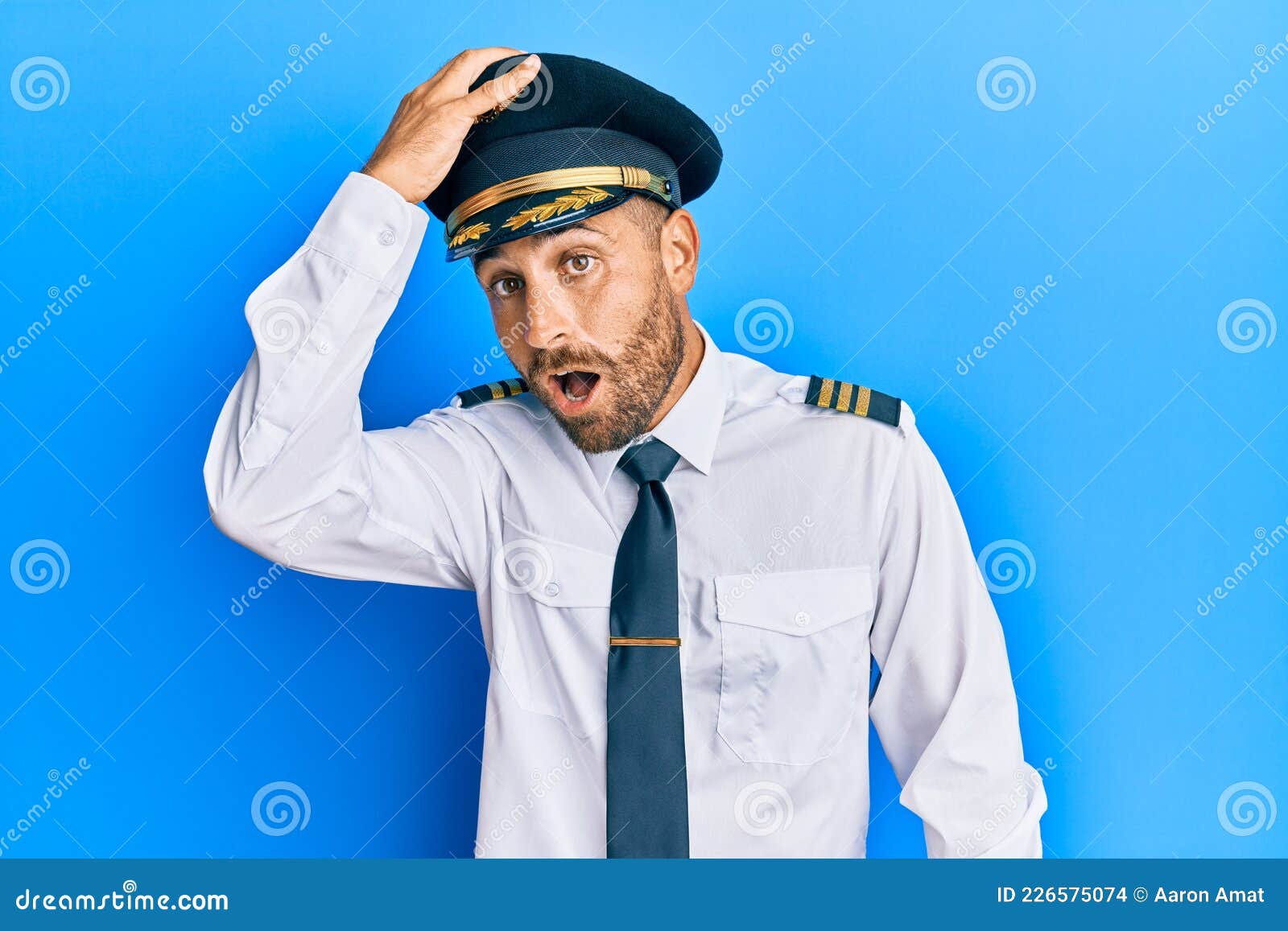 Handsome Man with Beard Wearing Airplane Pilot Uniform Surprised with ...