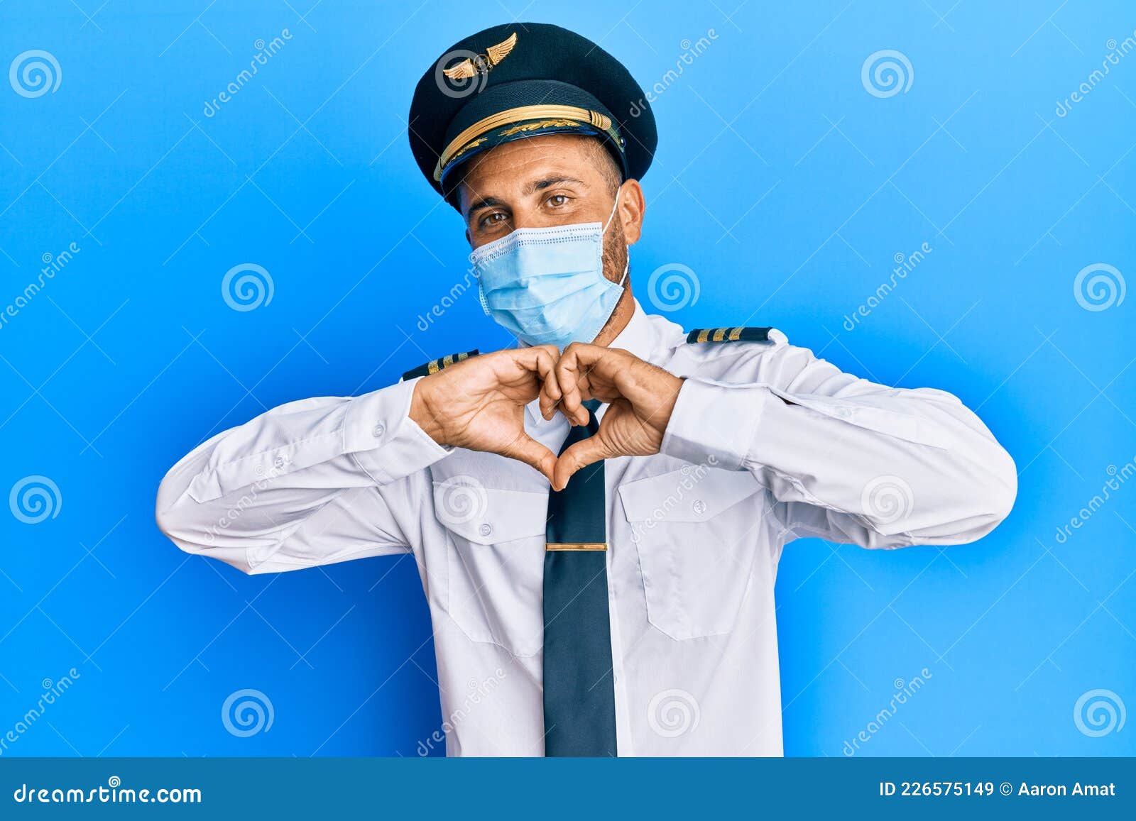 Handsome Man With Beard Wearing Airplane Pilot Uniform Wearing Safety